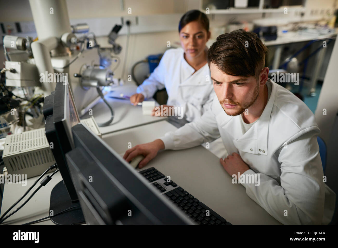 Scientist in laboratory using computer Stock Photo - Alamy