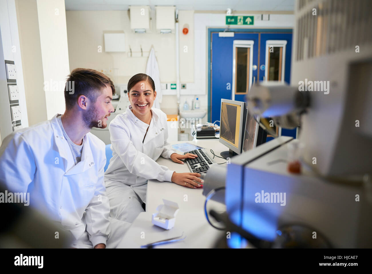 Scientist in laboratory using computer Stock Photo - Alamy