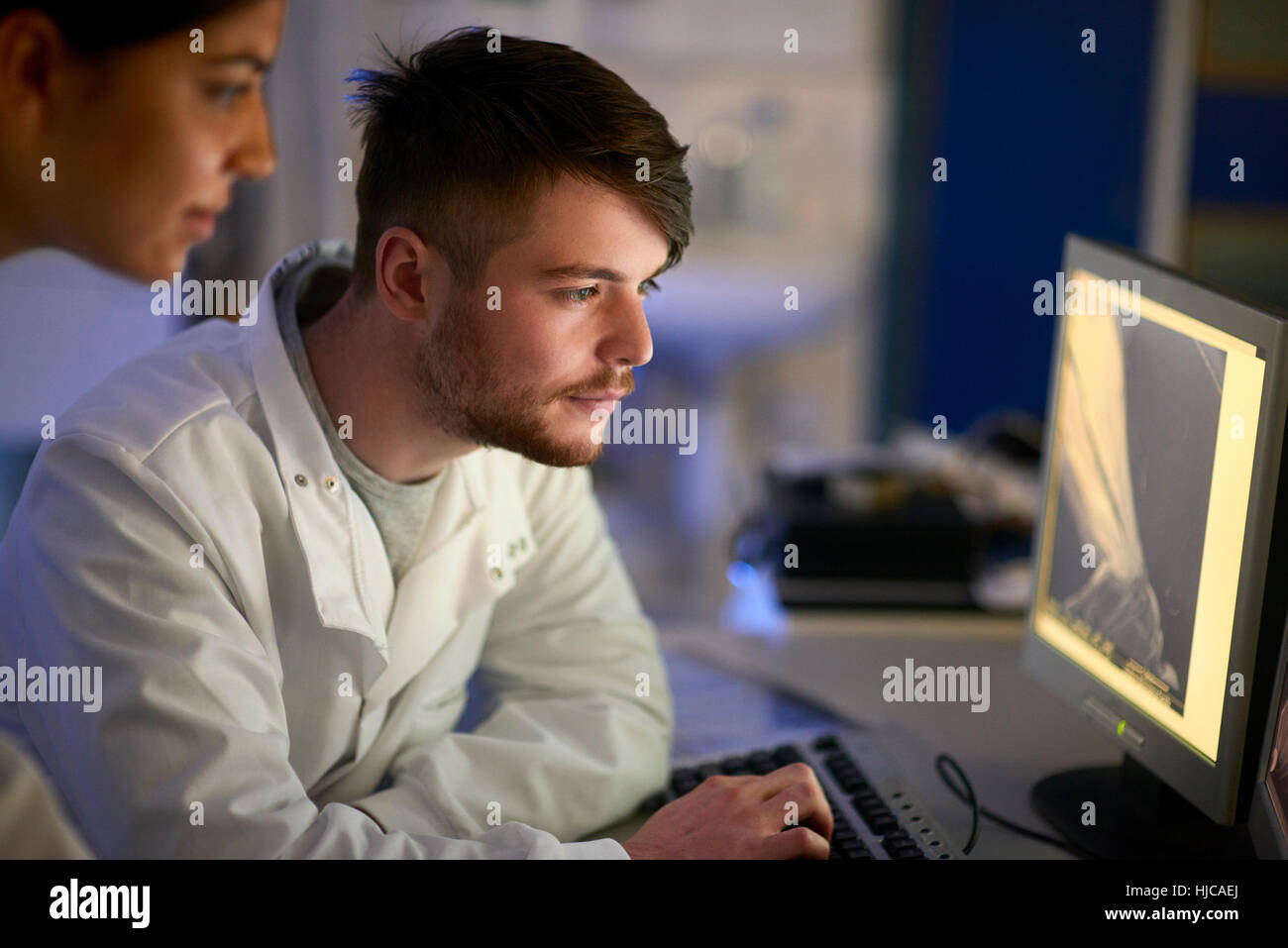 Scientist in laboratory using computer Stock Photo - Alamy