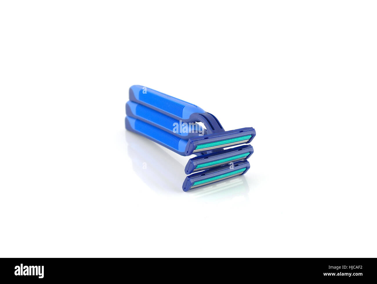 Three blue razors over white Stock Photo - Alamy