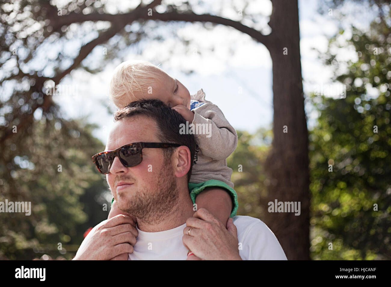 Father carrying son on shoulder hi-res stock photography and images - Alamy