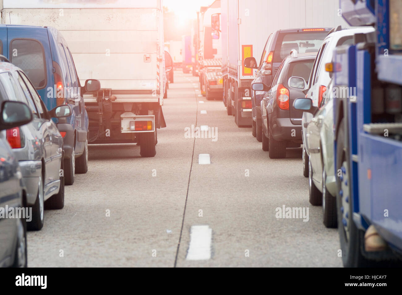 Rear view of rows of traffic queueing on highway Stock Photo - Alamy