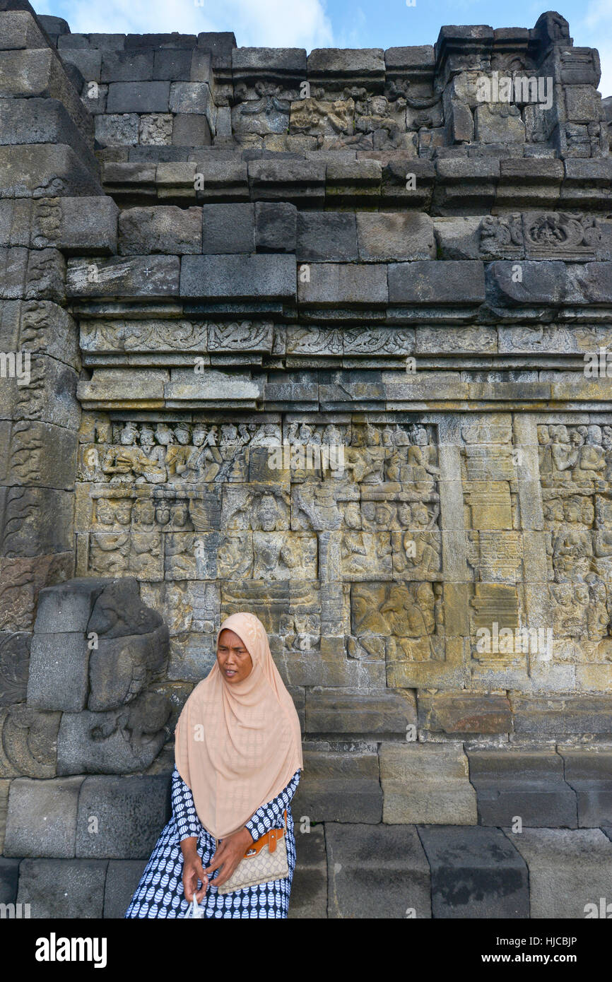 Yogyakarta, Java, Indonesia: Unidentified woman resting in the Buddhist ...