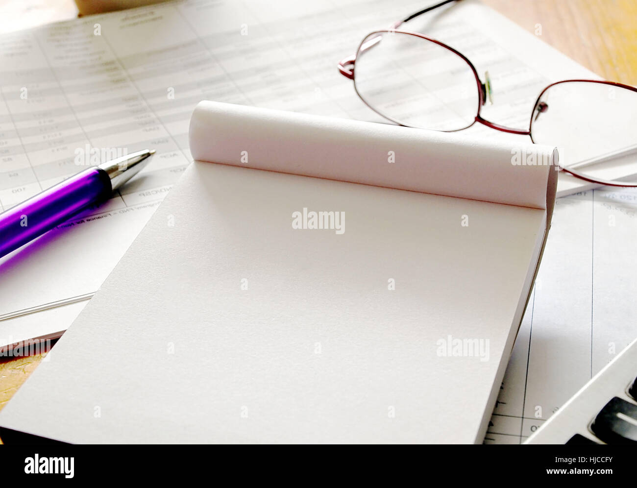 Blank paper note on office table desk of business strategy. Writing ...