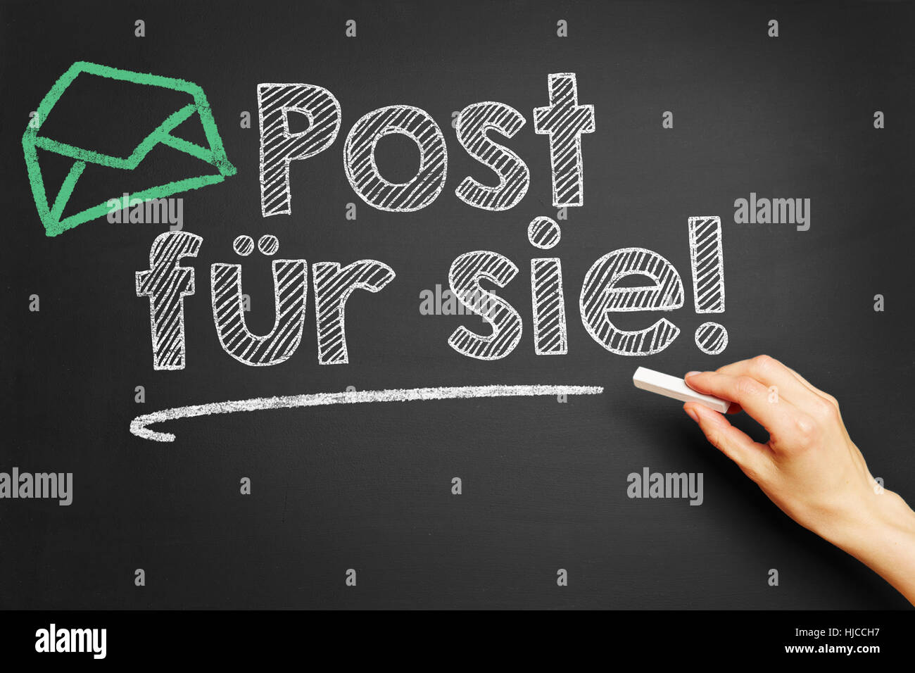 Hand writing in German "Post fuer sie!" (mail for you) on a blackboard ...