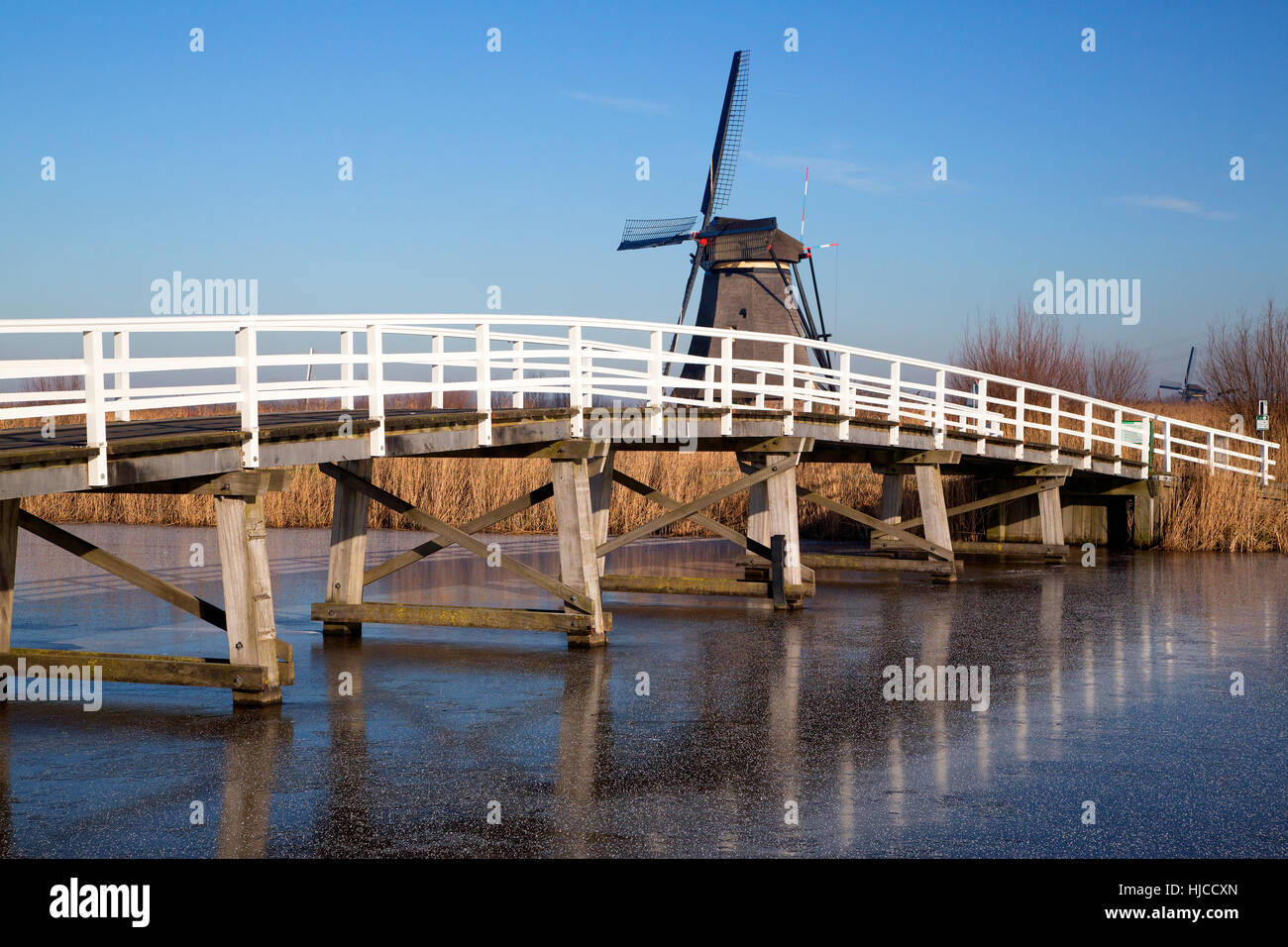 Wooden bridge in Unesco World Heritage Site Kinderdijk, South Holland ...