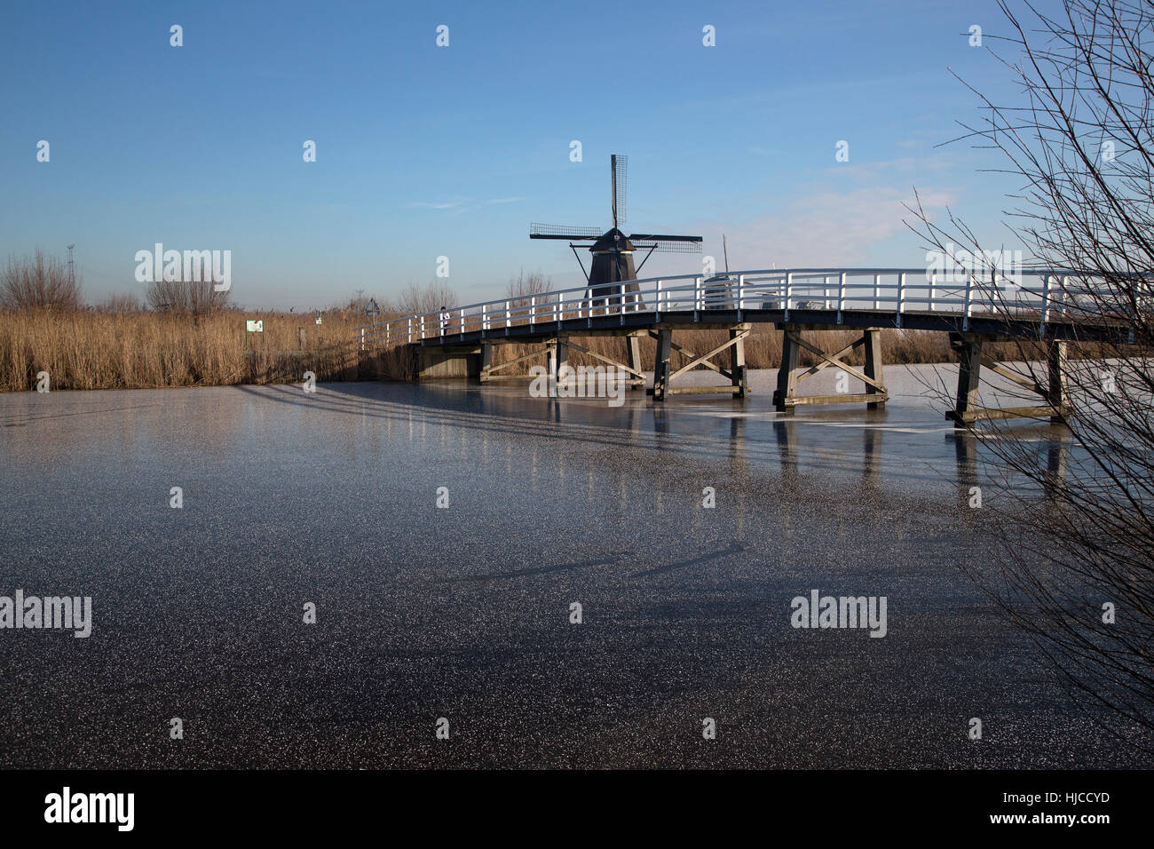 Wooden bridge in Unesco World Heritage Site Kinderdijk, South Holland ...