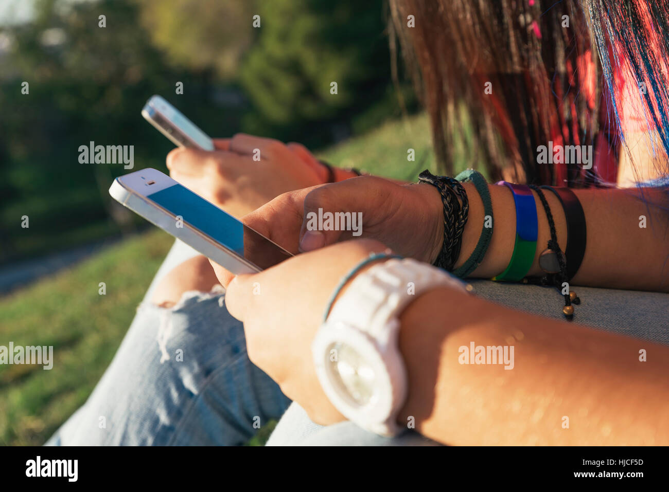 Two friend hands texting in their smartphones in the park Stock Photo ...