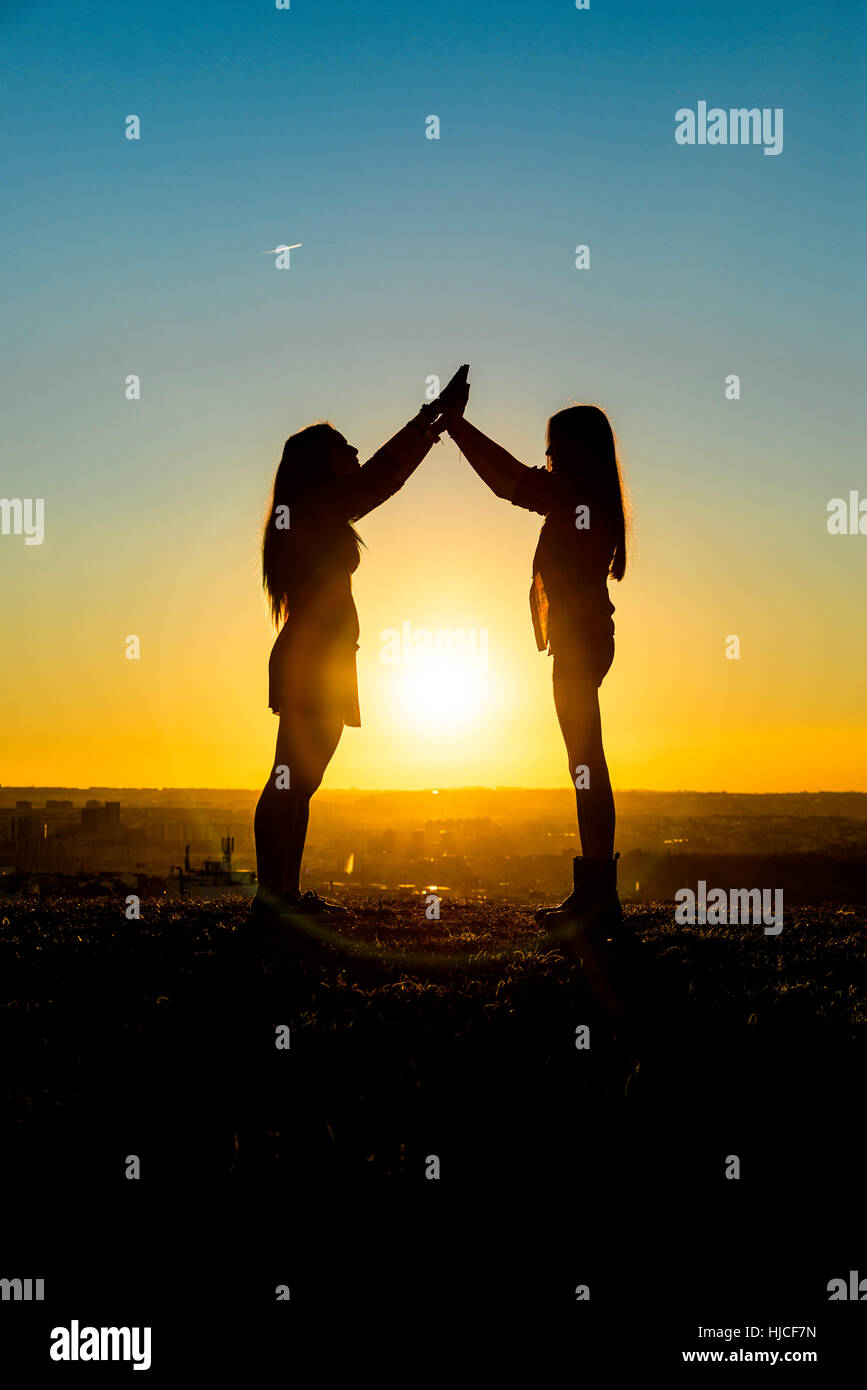Teen friends having fun in sunset. Concept of female friendship Stock ...