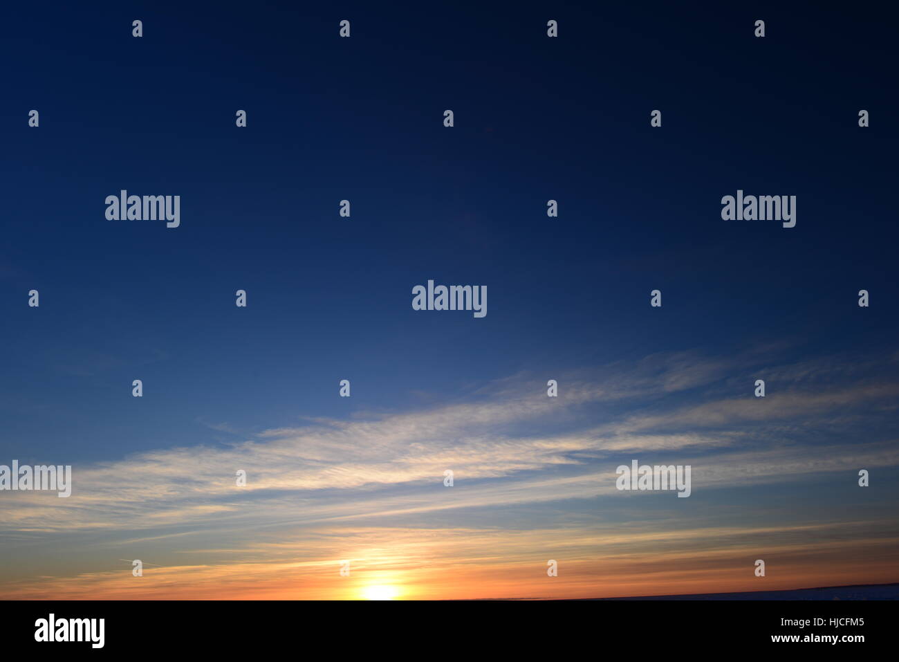 Light sunset twilight in clear blue winter sky Stock Photo - Alamy