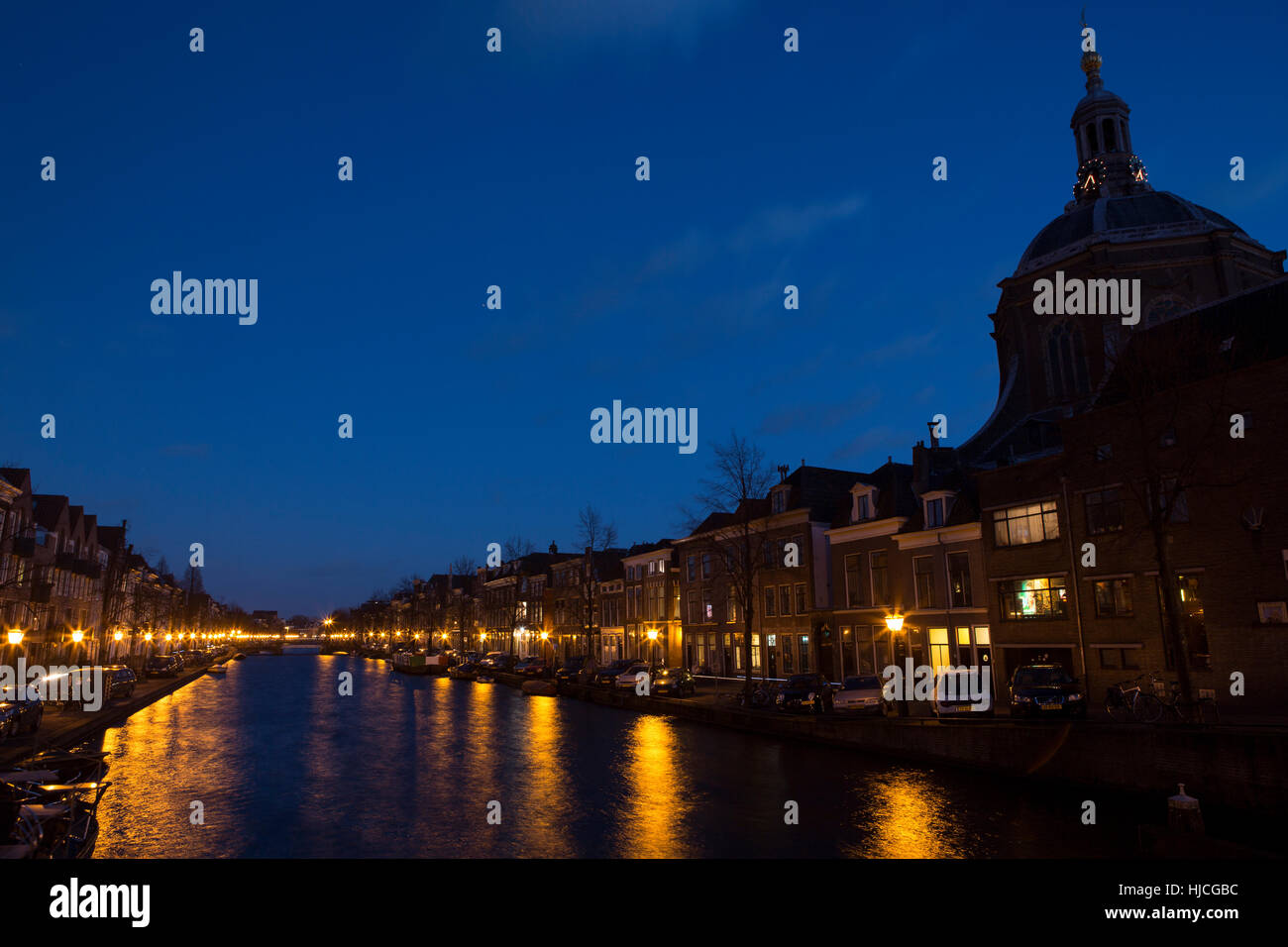 Night view of a canal in the Dutch University town of Leiden. Blue hour ...