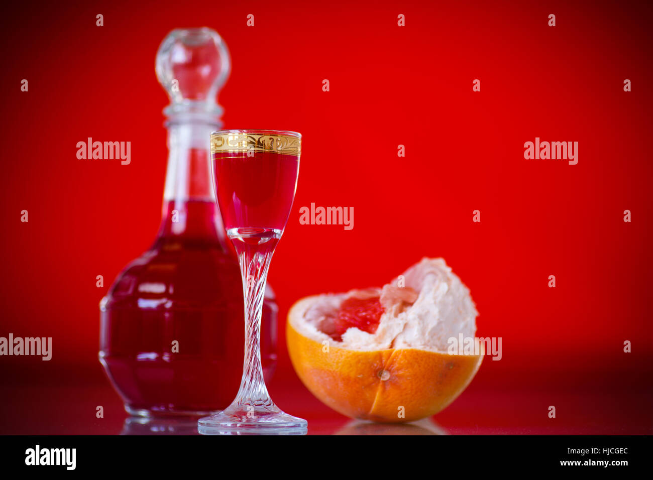 sweet grapefruit alcoholic cordial in the decanter with a glass Stock ...