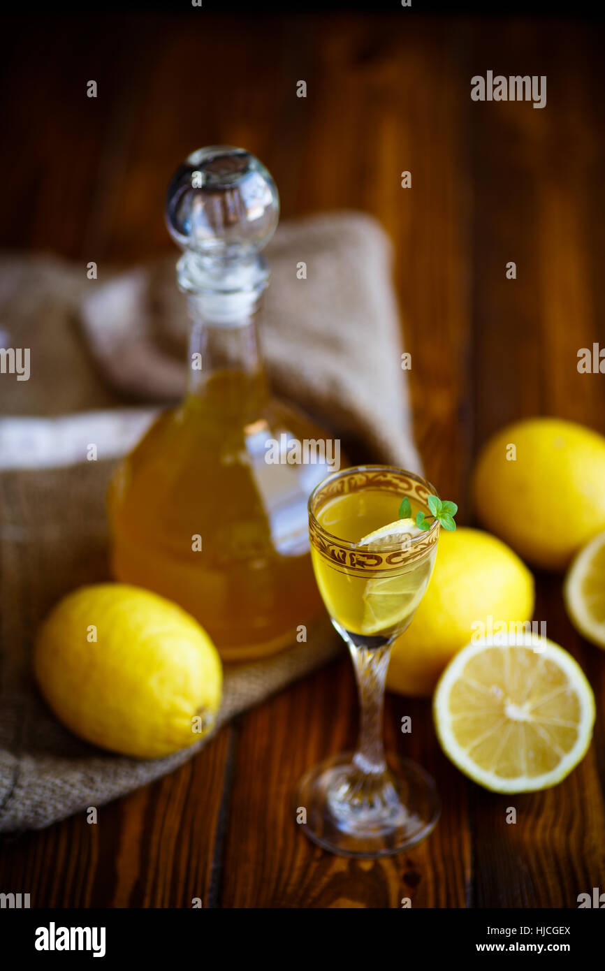 sweet lemon alcoholic brandy in the decanter Stock Photo - Alamy