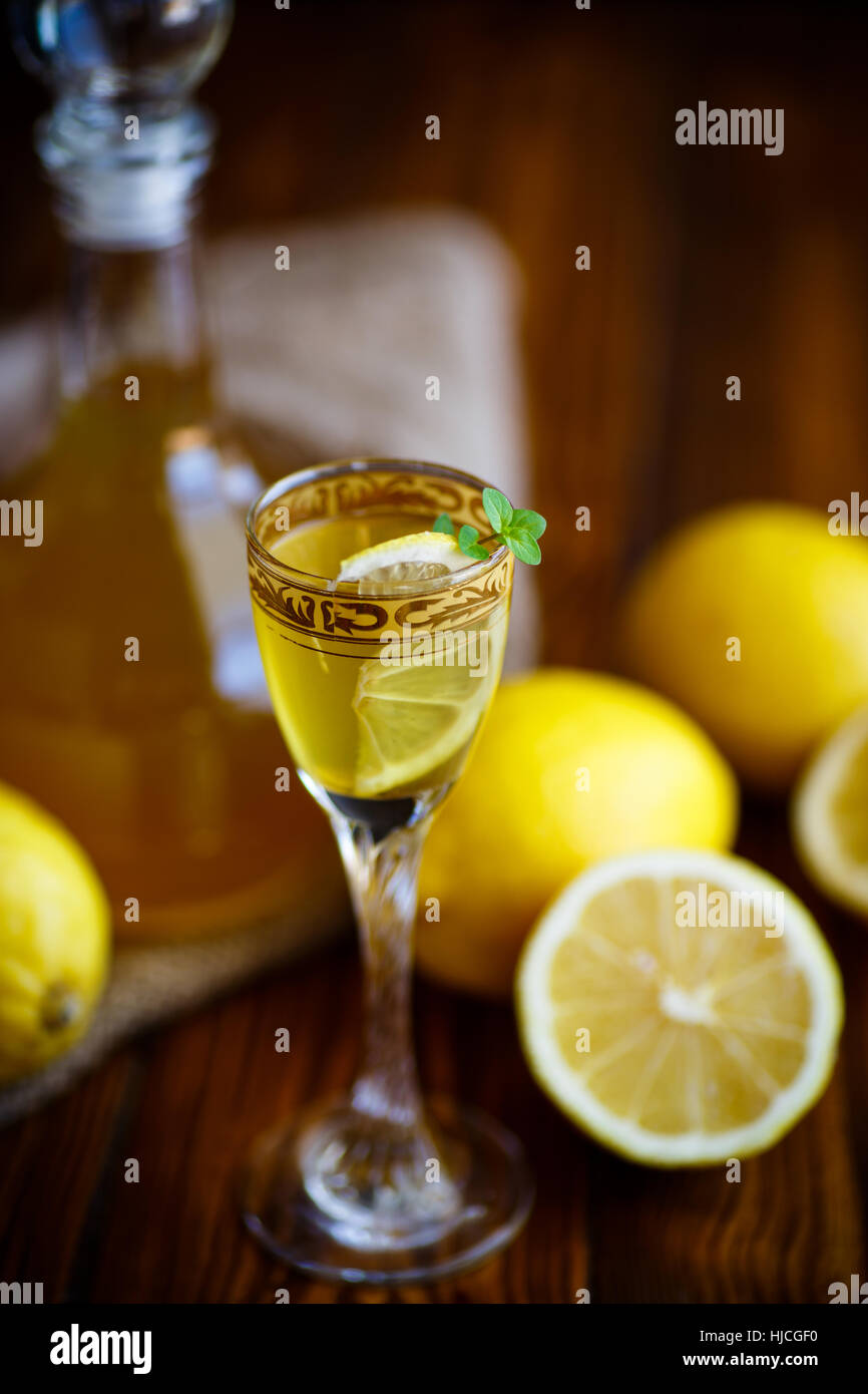 sweet lemon alcoholic brandy in the decanter Stock Photo - Alamy