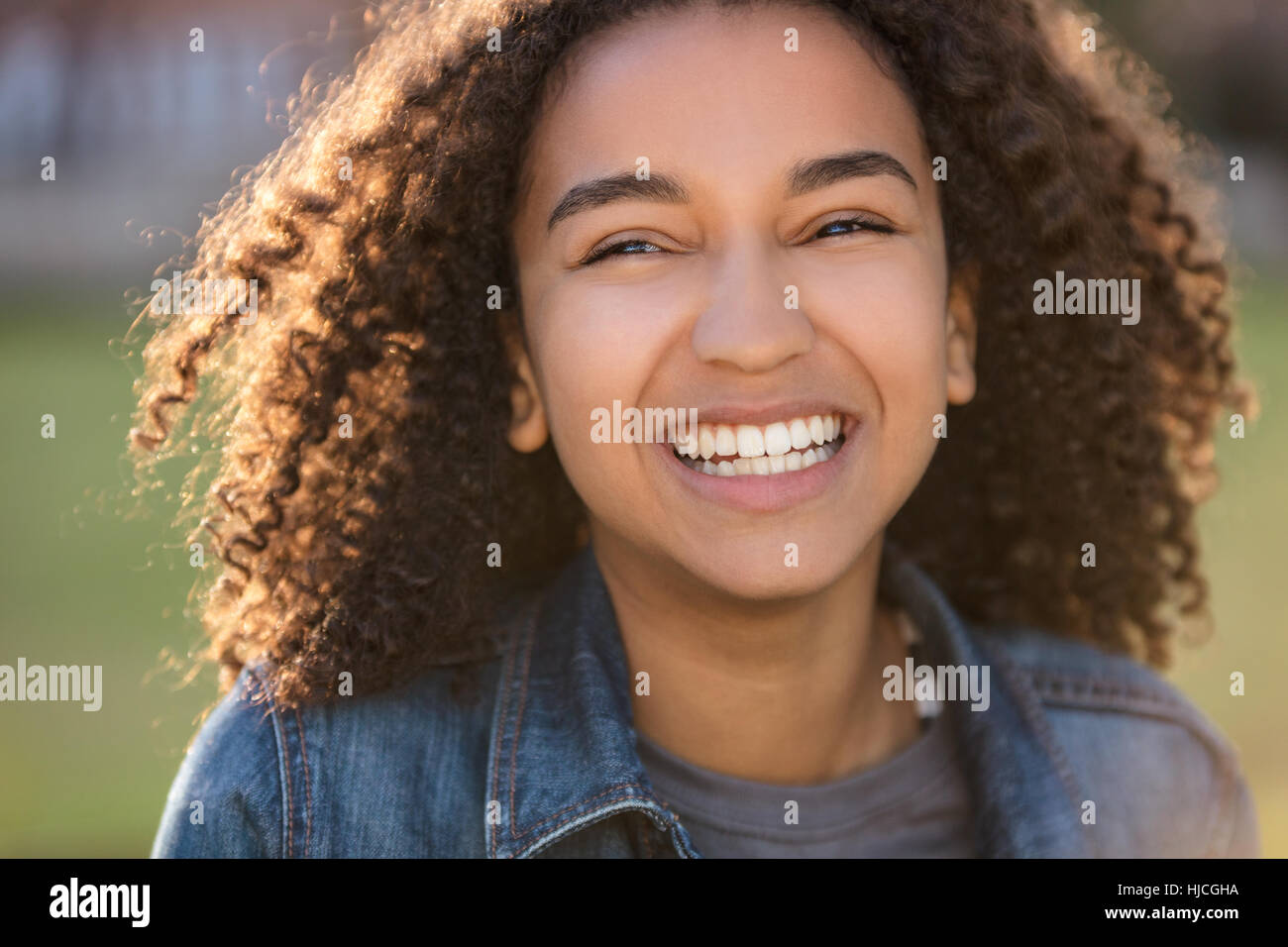 Outdoor Portrait Of Beautiful Happy Mixed Race African American Girl