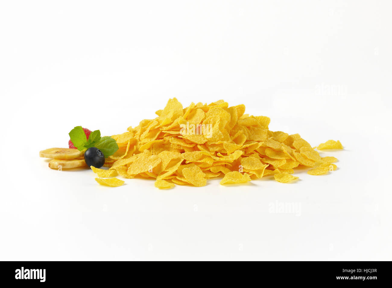 pile of corn flakes on white background Stock Photo - Alamy