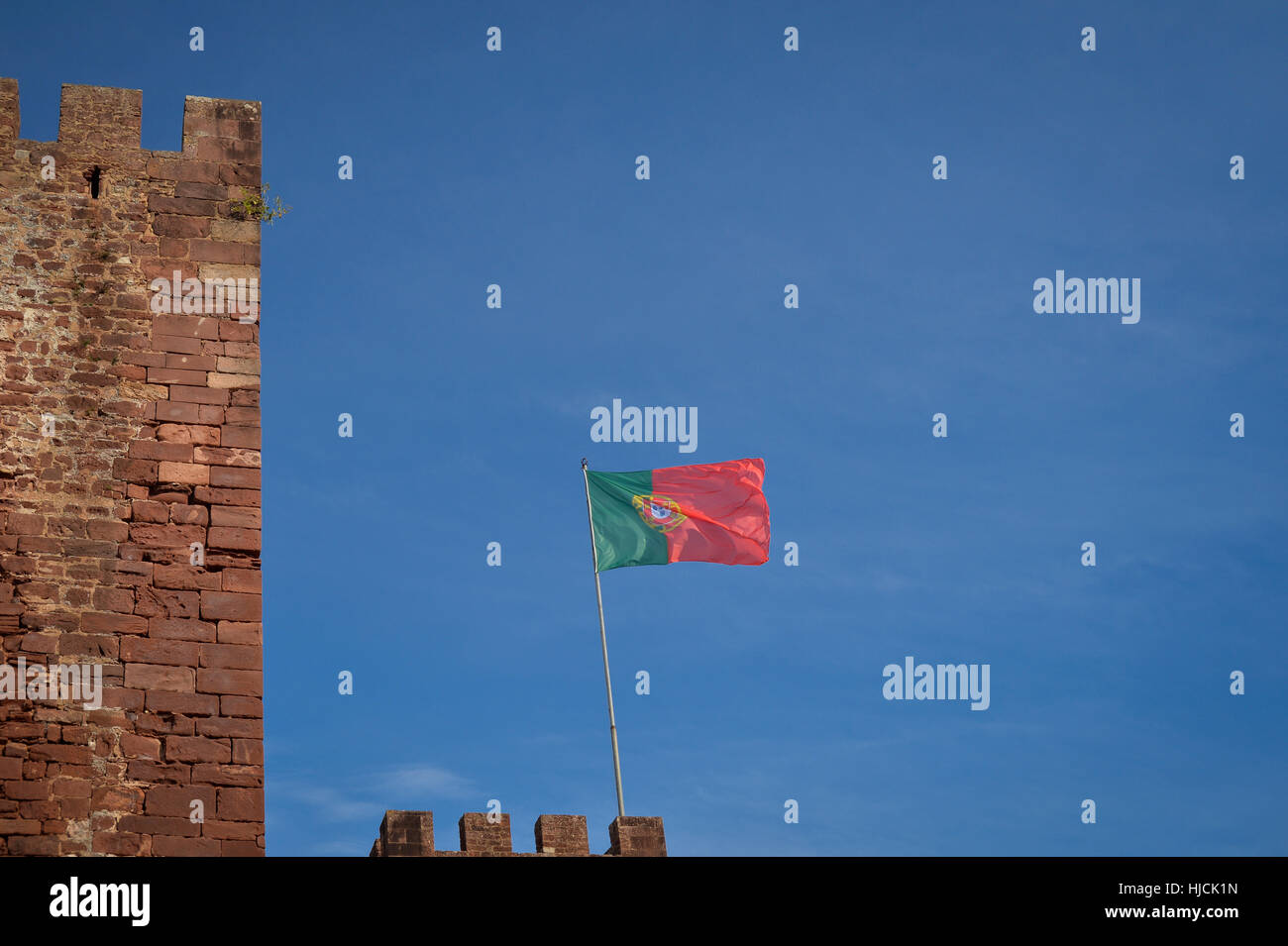 Portuguese flag flying blue sky Stock Photo - Alamy
