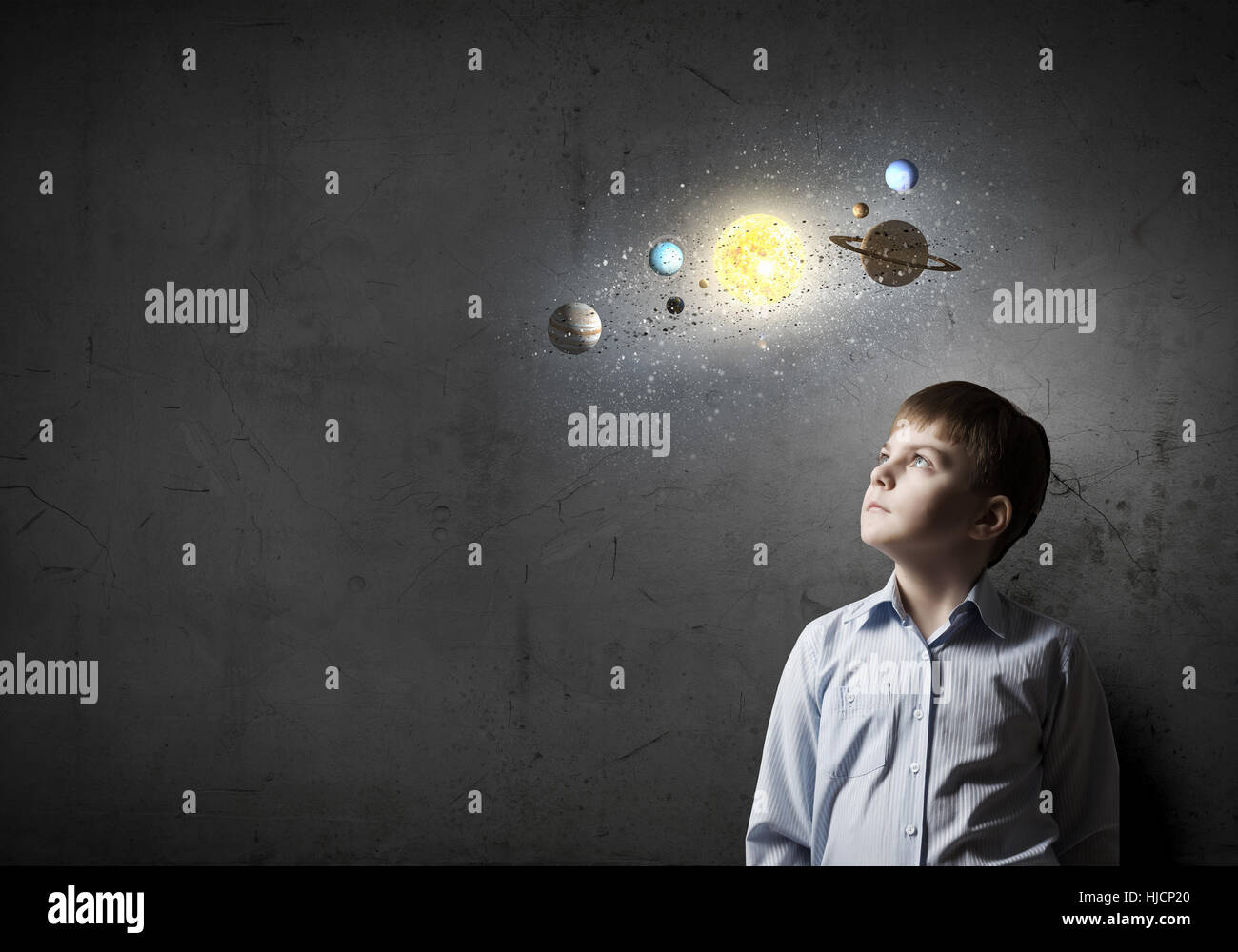 Cute boy of school age exploring space system hi-res stock photography ...