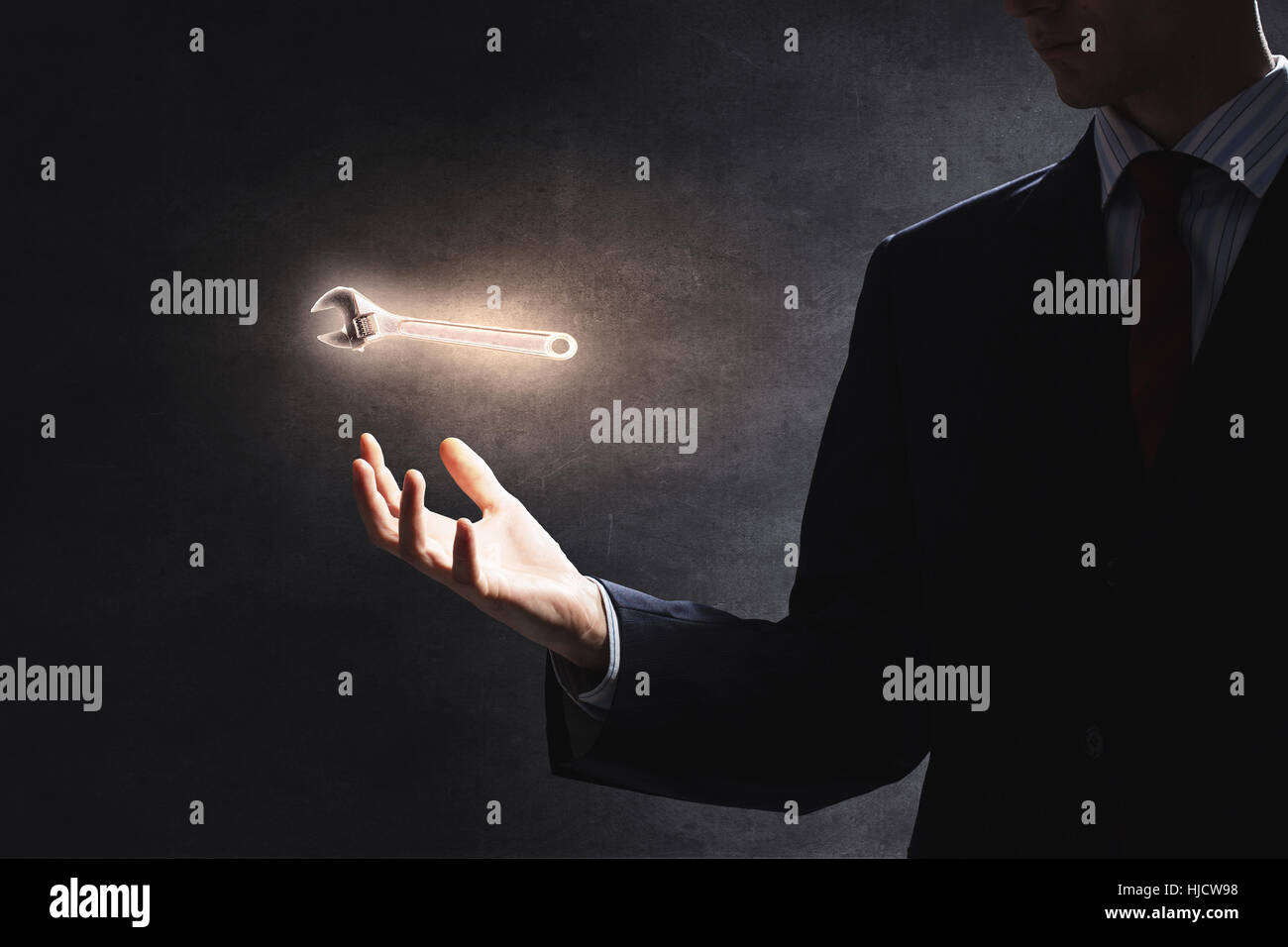 Close up of male hand and wrench in palm Stock Photo - Alamy