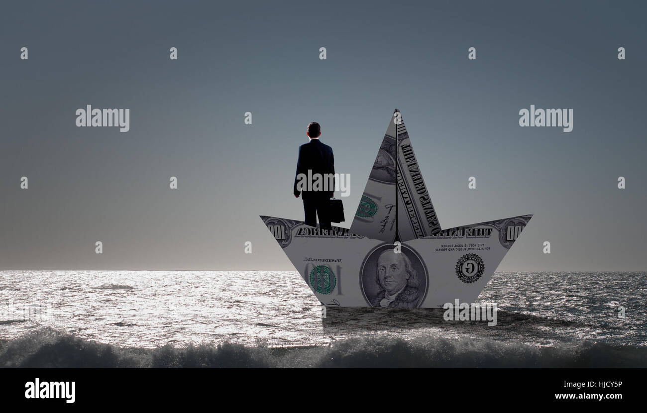 Successful businessman sailing on dollar boat in financial sea hi-res ...
