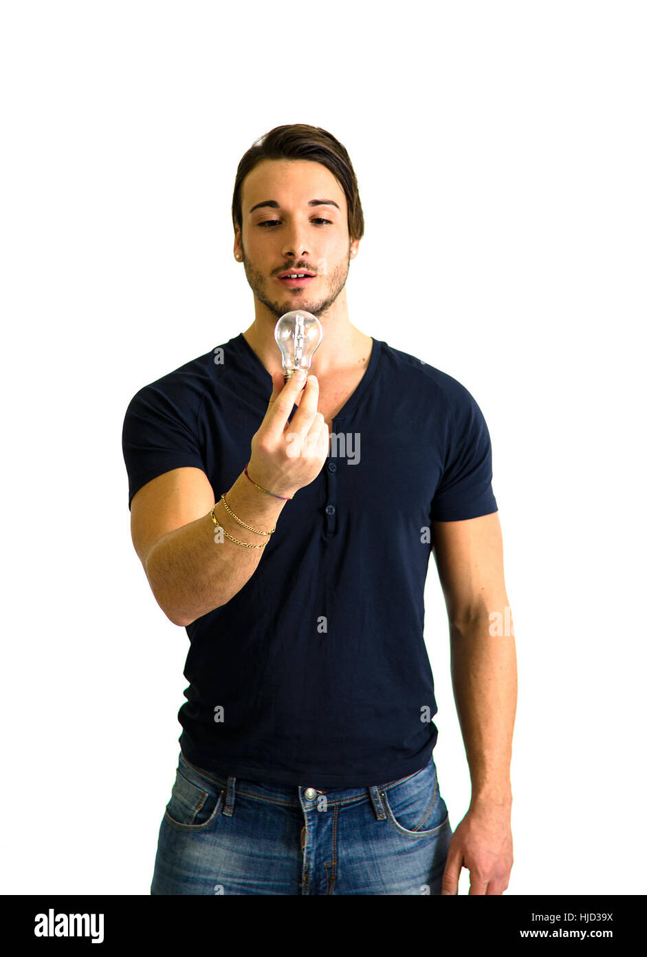 Young man looking at lit up lightbulb. Idea, enlightment concept Stock ...