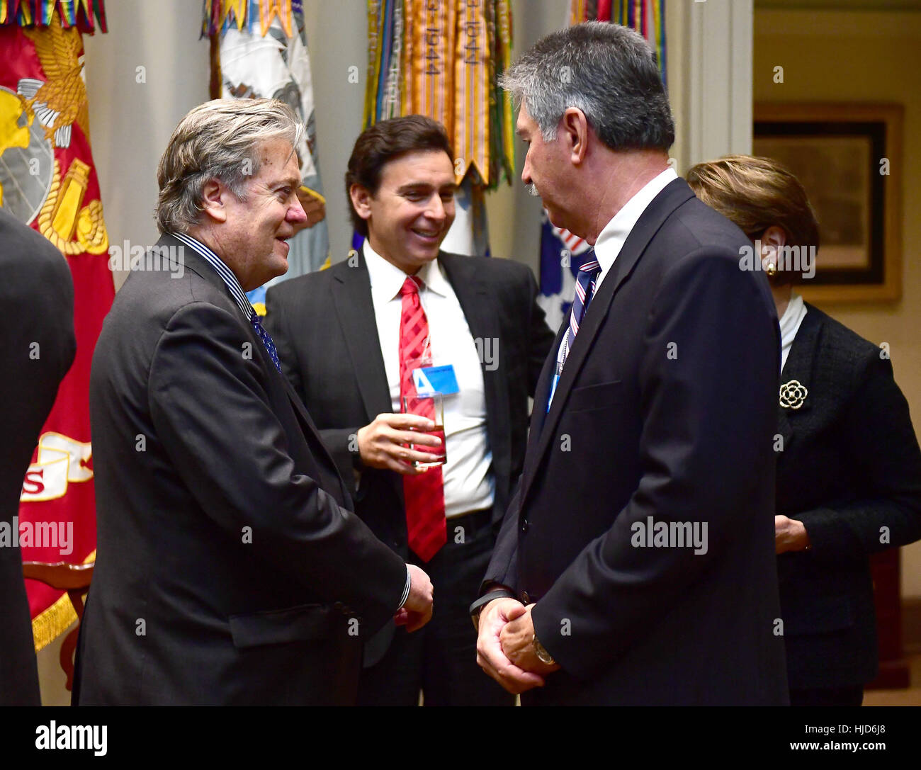 Steven K. Bannon, left, speaks with Mario Longhi of US Steel, right ...