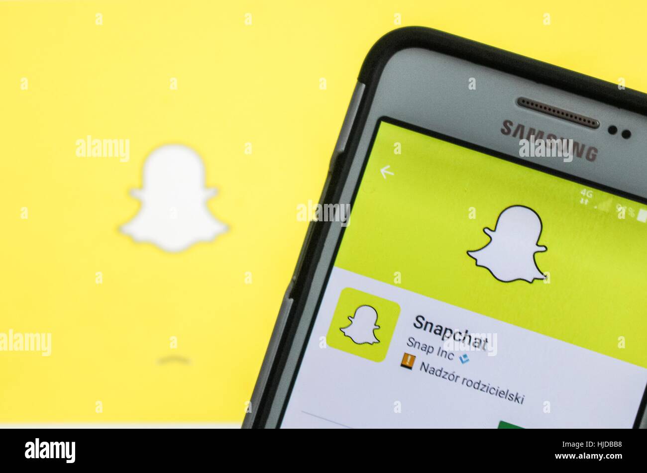 Man holding Samsung smartphone in hand, with Snapchat app running is ...