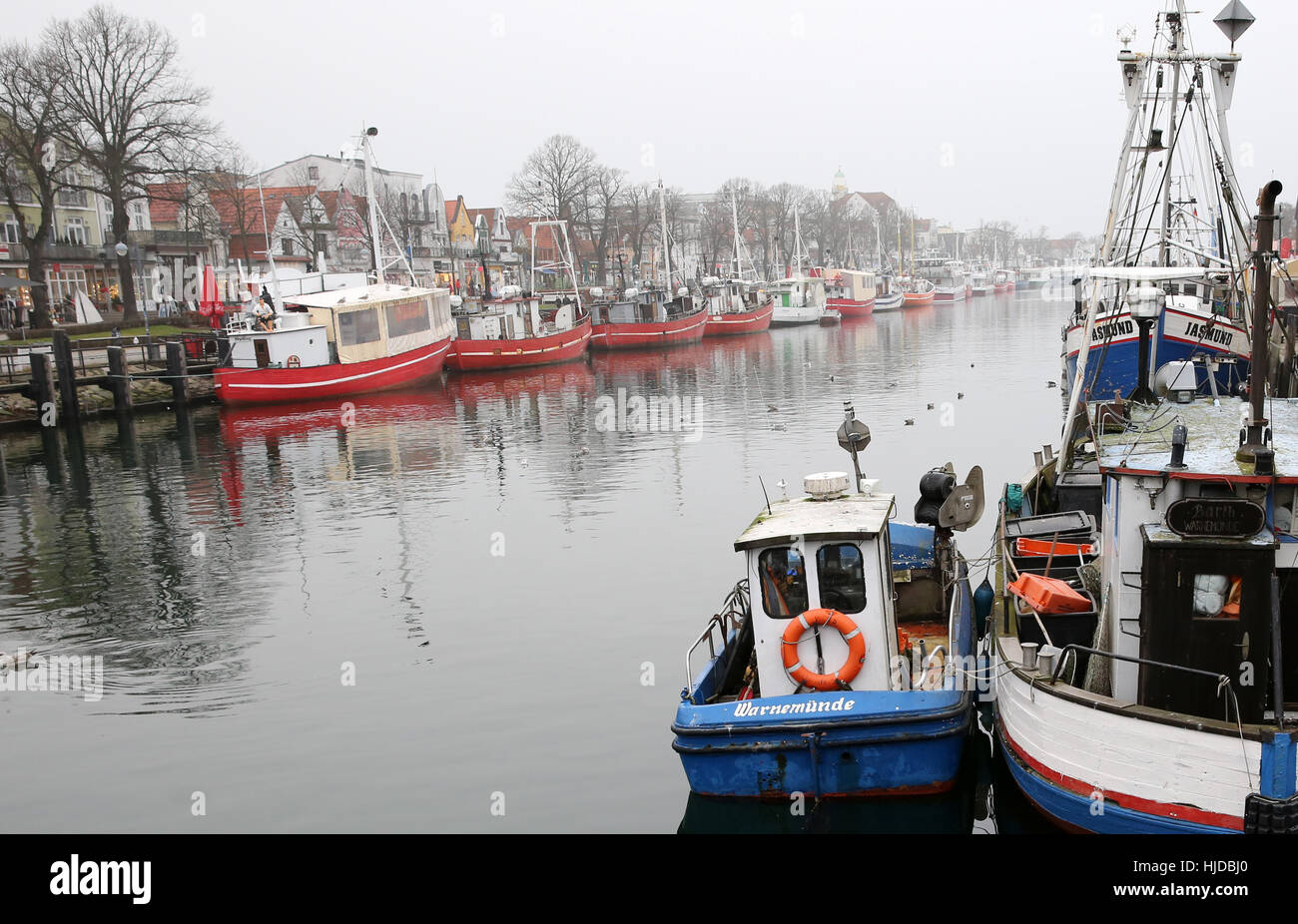 Fishing boats and pleasure barges lie at the Alte Strom of the ...