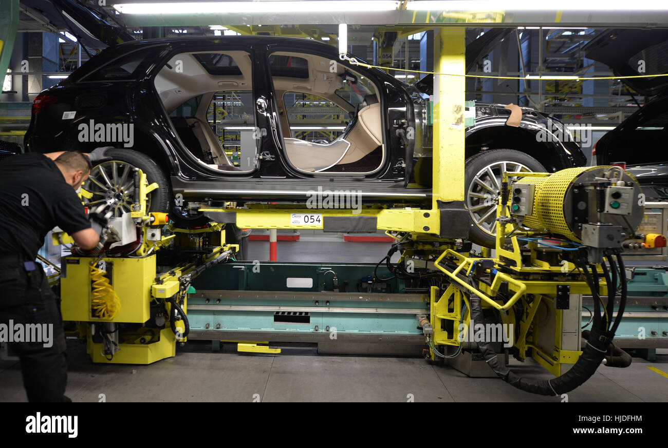 An employee works on a GLC-Class at the Mercedes Benz manufactory in ...