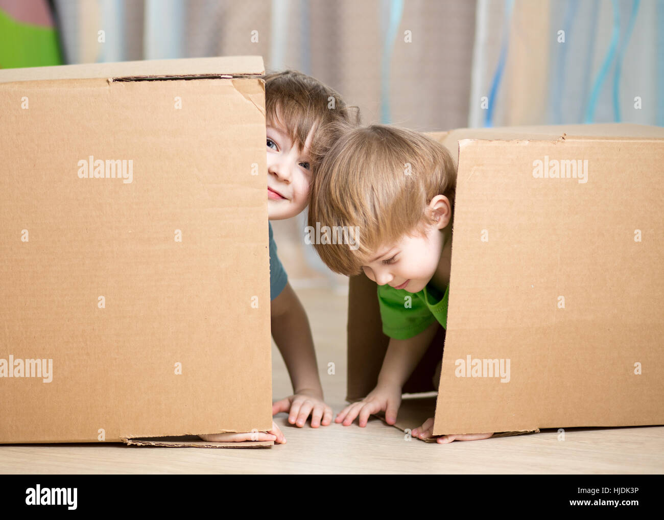 Children playing with boxes hi-res stock photography and images - Alamy
