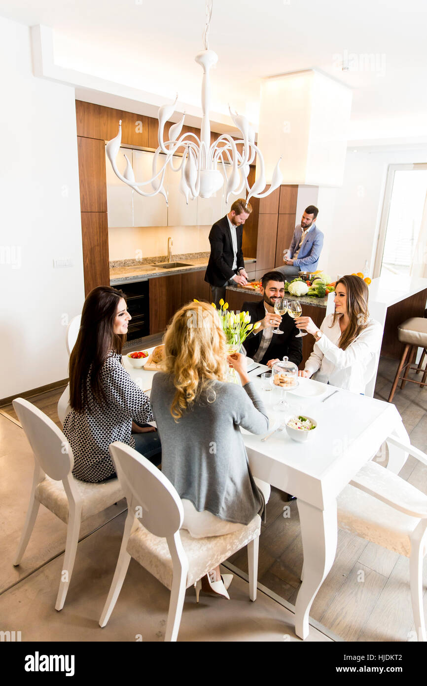 View at friends having dinner at home Stock Photo - Alamy