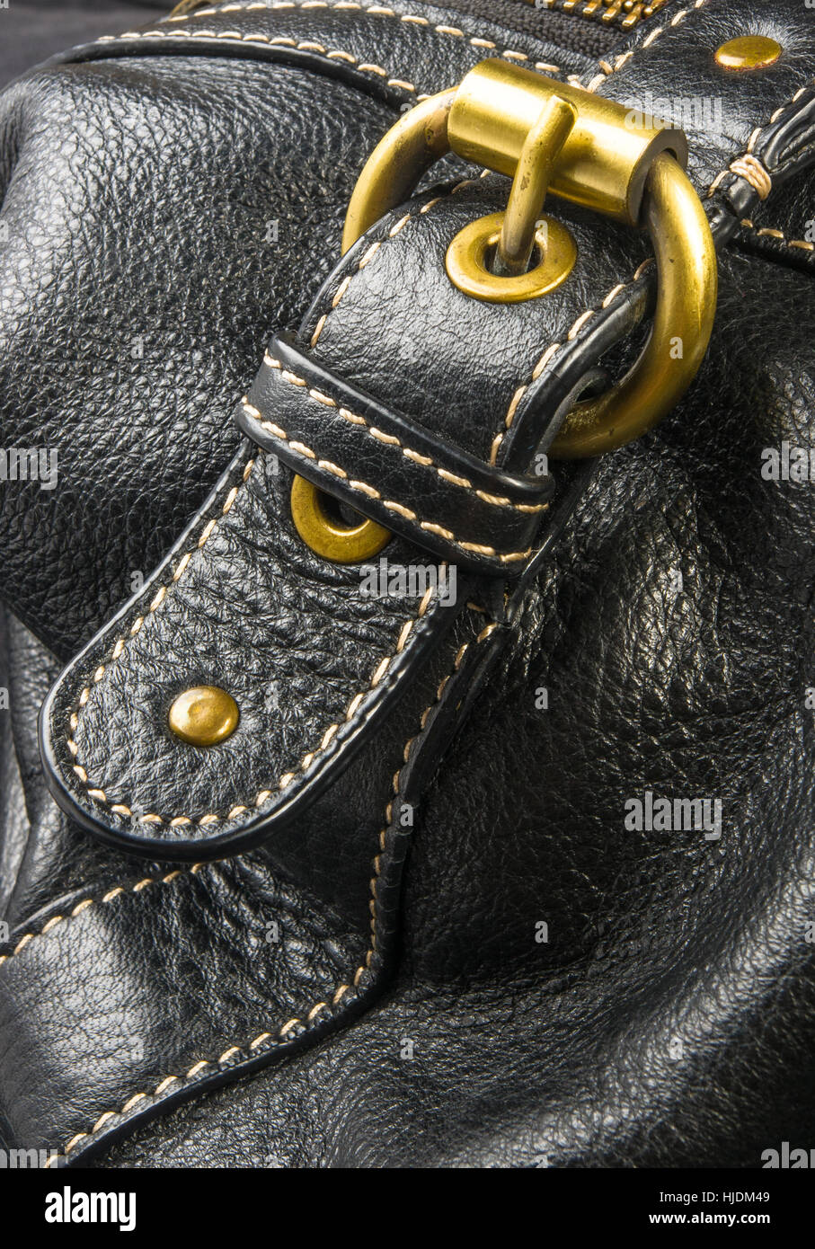 closeup of the fittings on the black leather hand bag Stock Photo - Alamy