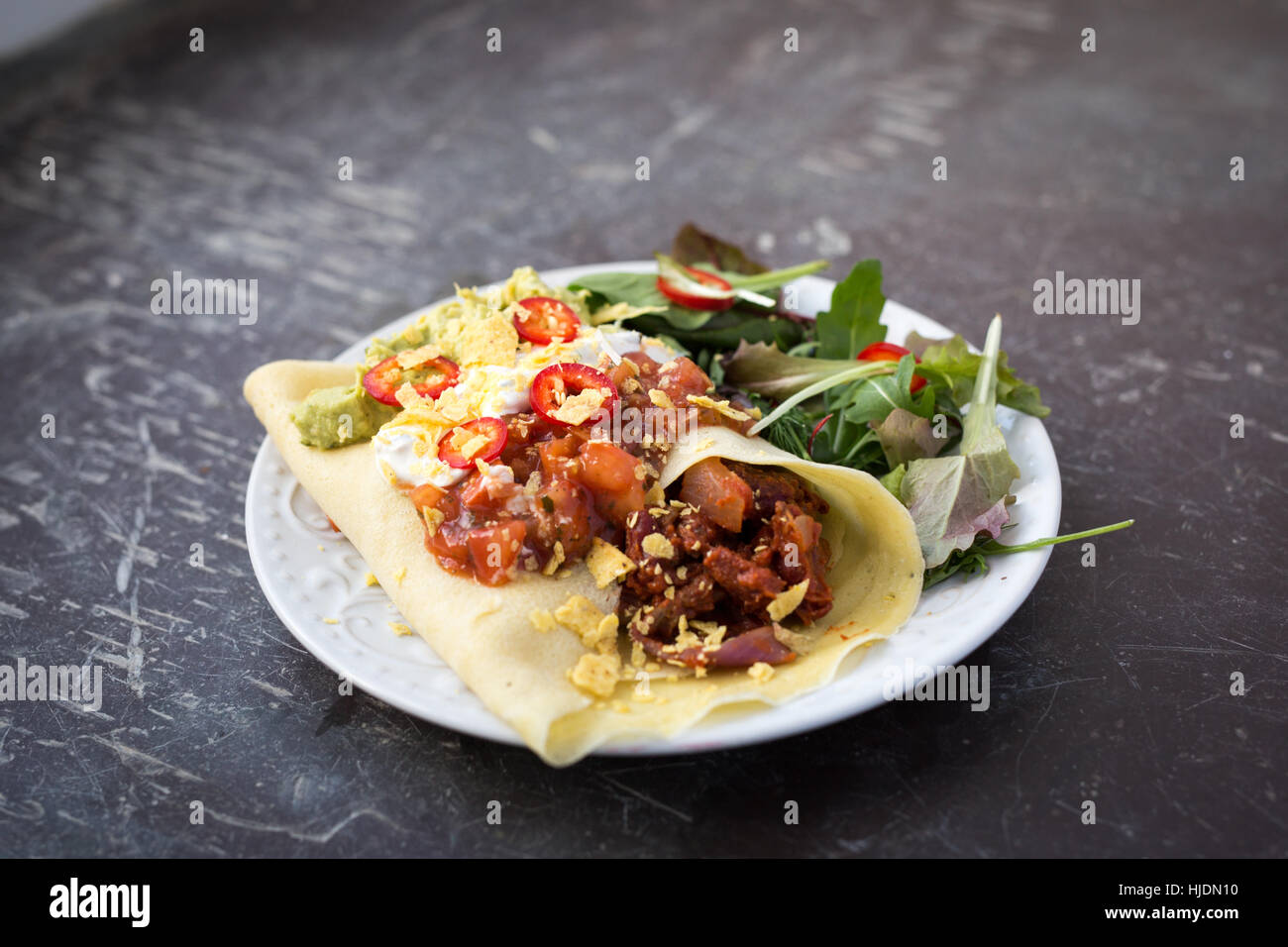 Mexican chilli crepe on a plate Stock Photo - Alamy
