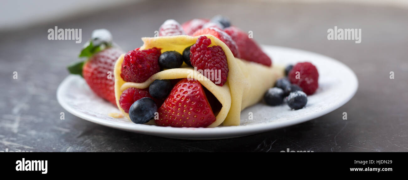 Healthy berry crepe on a plate Stock Photo - Alamy