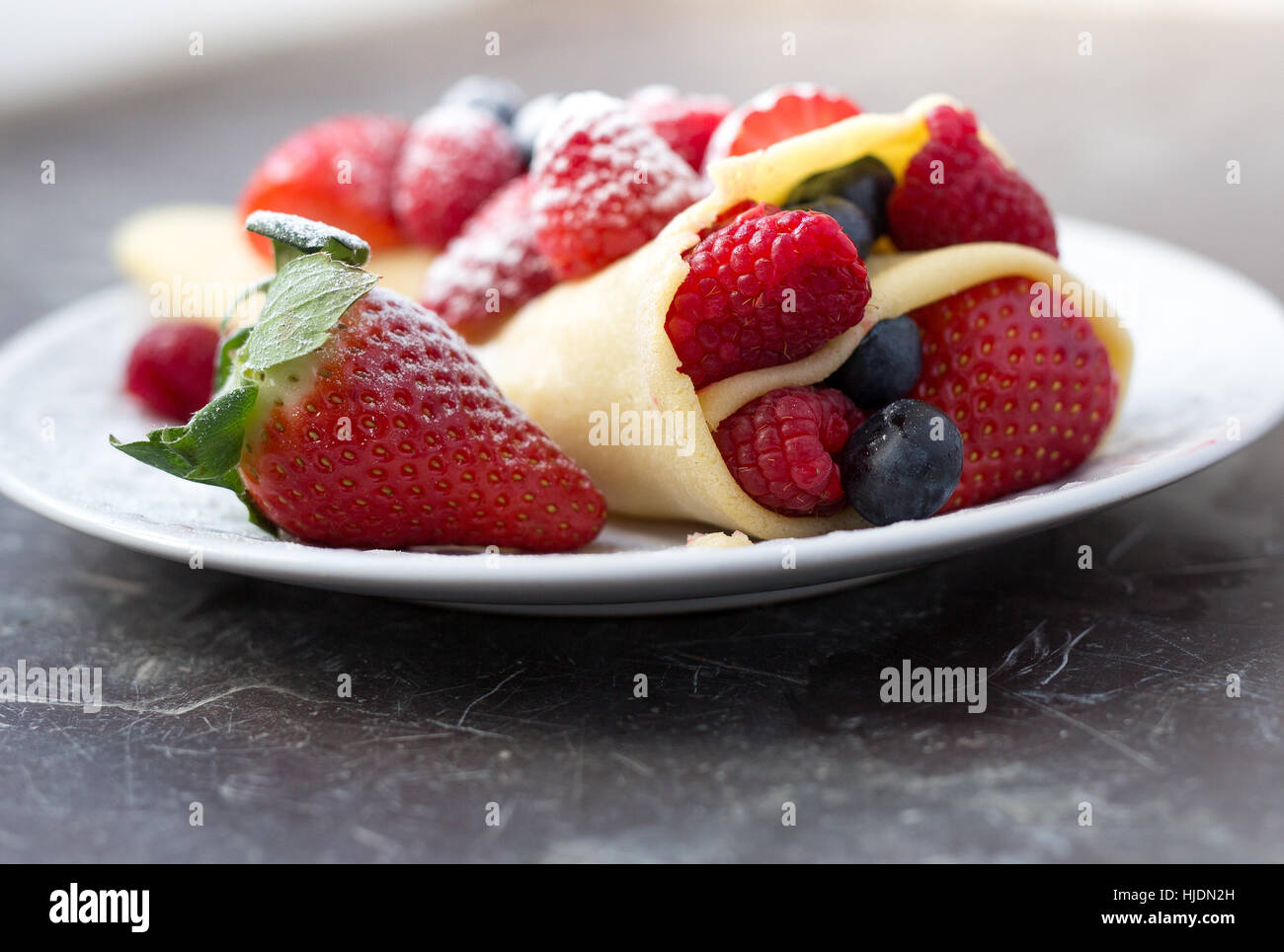 Healthy berry crepe on a plate Stock Photo - Alamy