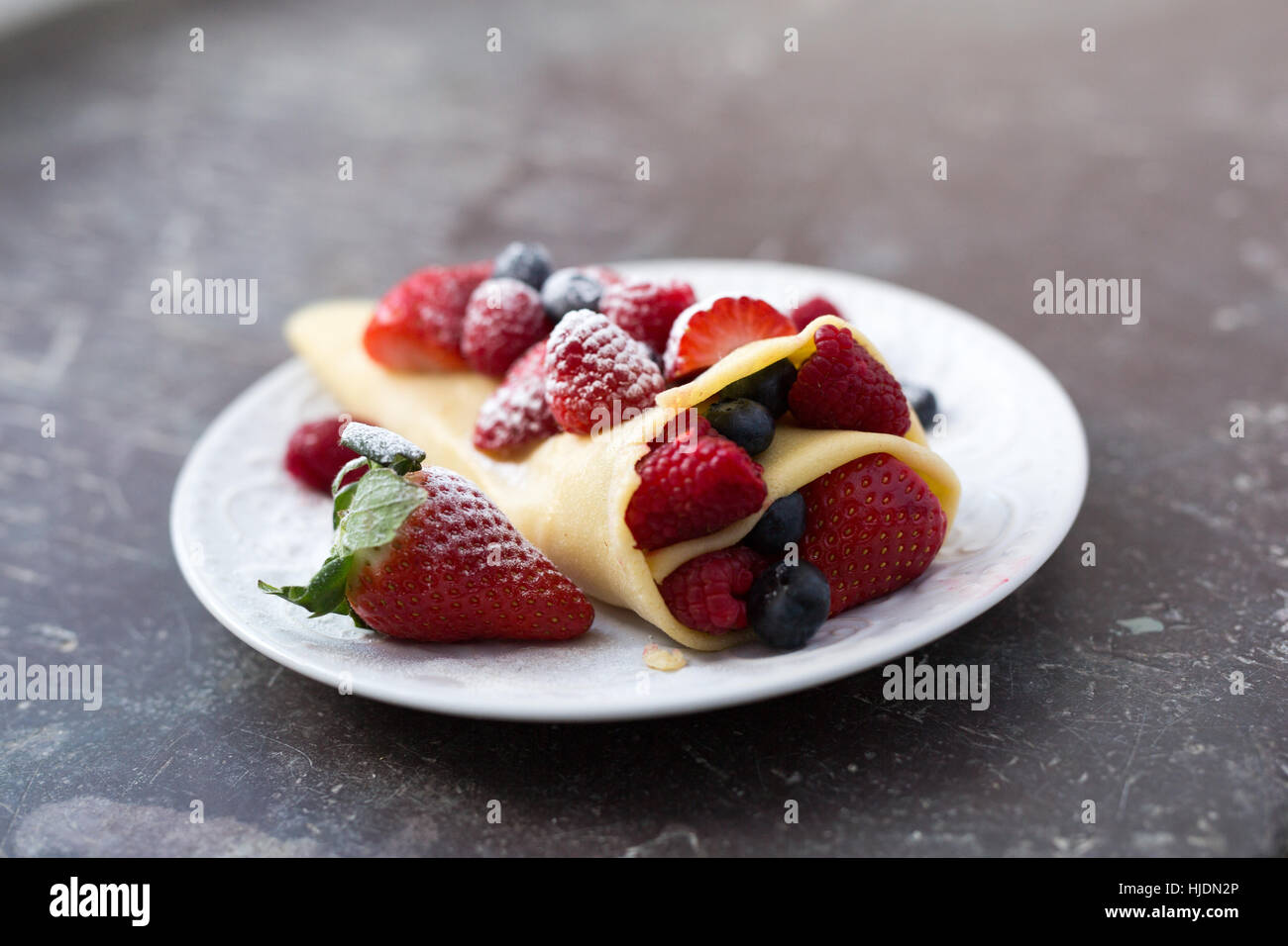 Healthy berry crepe on a plate Stock Photo - Alamy
