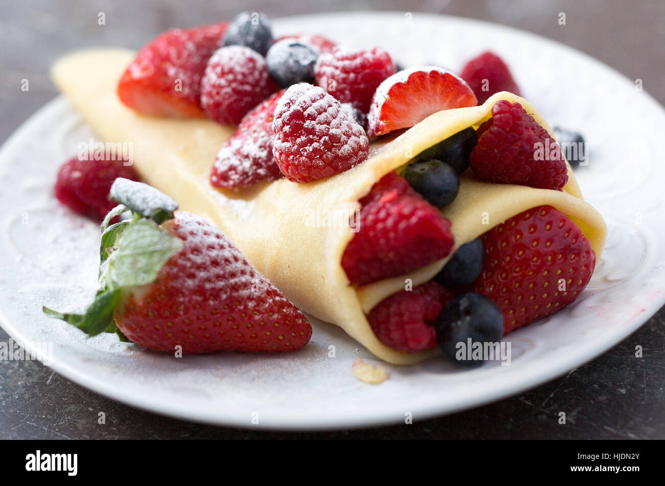 Healthy berry crepe on a plate Stock Photo - Alamy