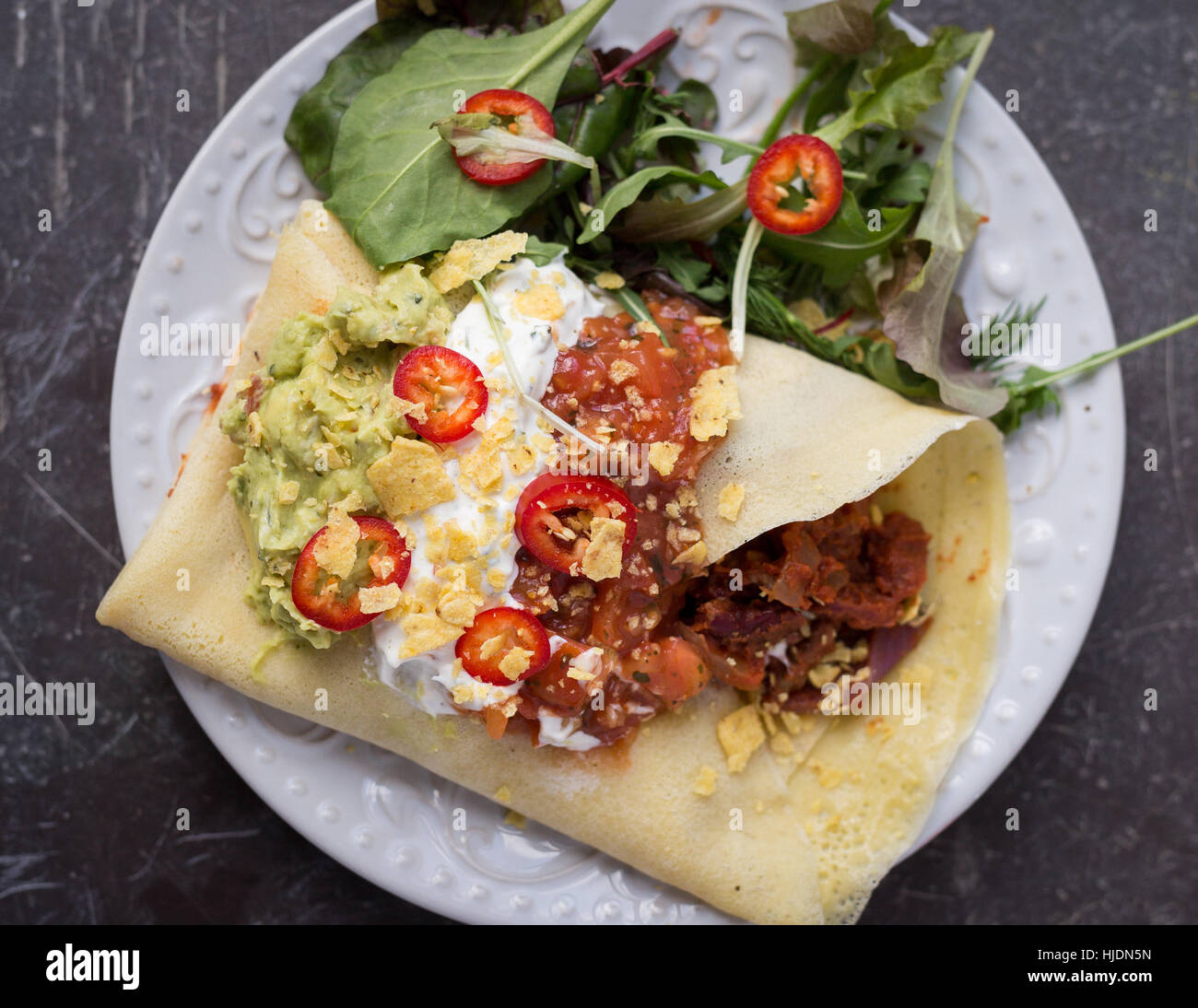 Mexican style crepe on a plate Stock Photo - Alamy