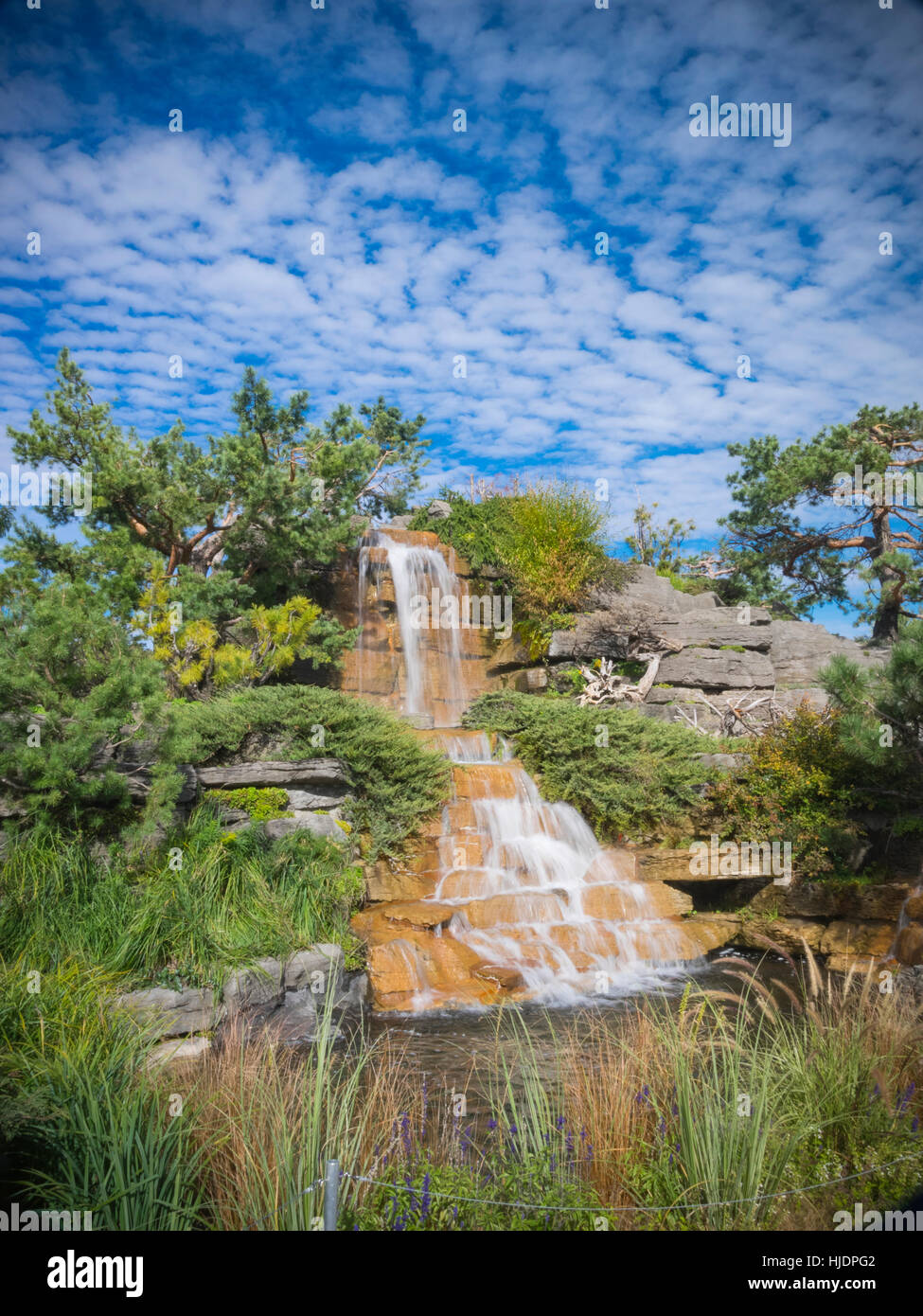 Waterfall in a landscape Stock Photo - Alamy