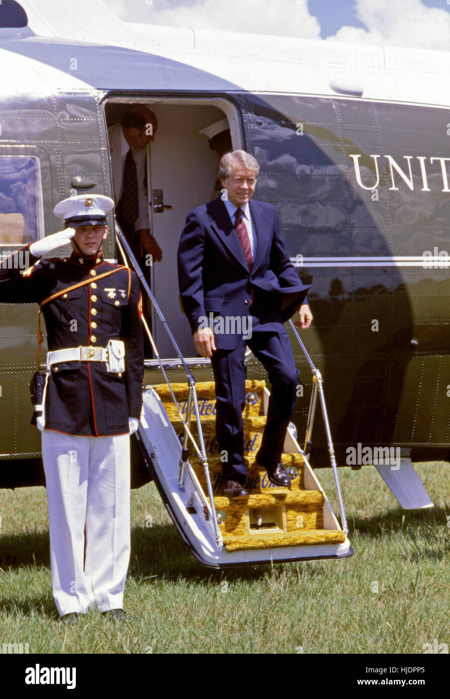 President Jimmy Carter is saluted by a Marine guard as he steps from ...
