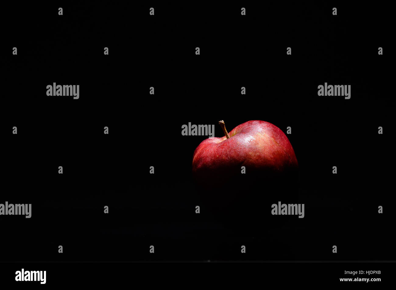Red Apple On Black Background Stock Photo - Alamy