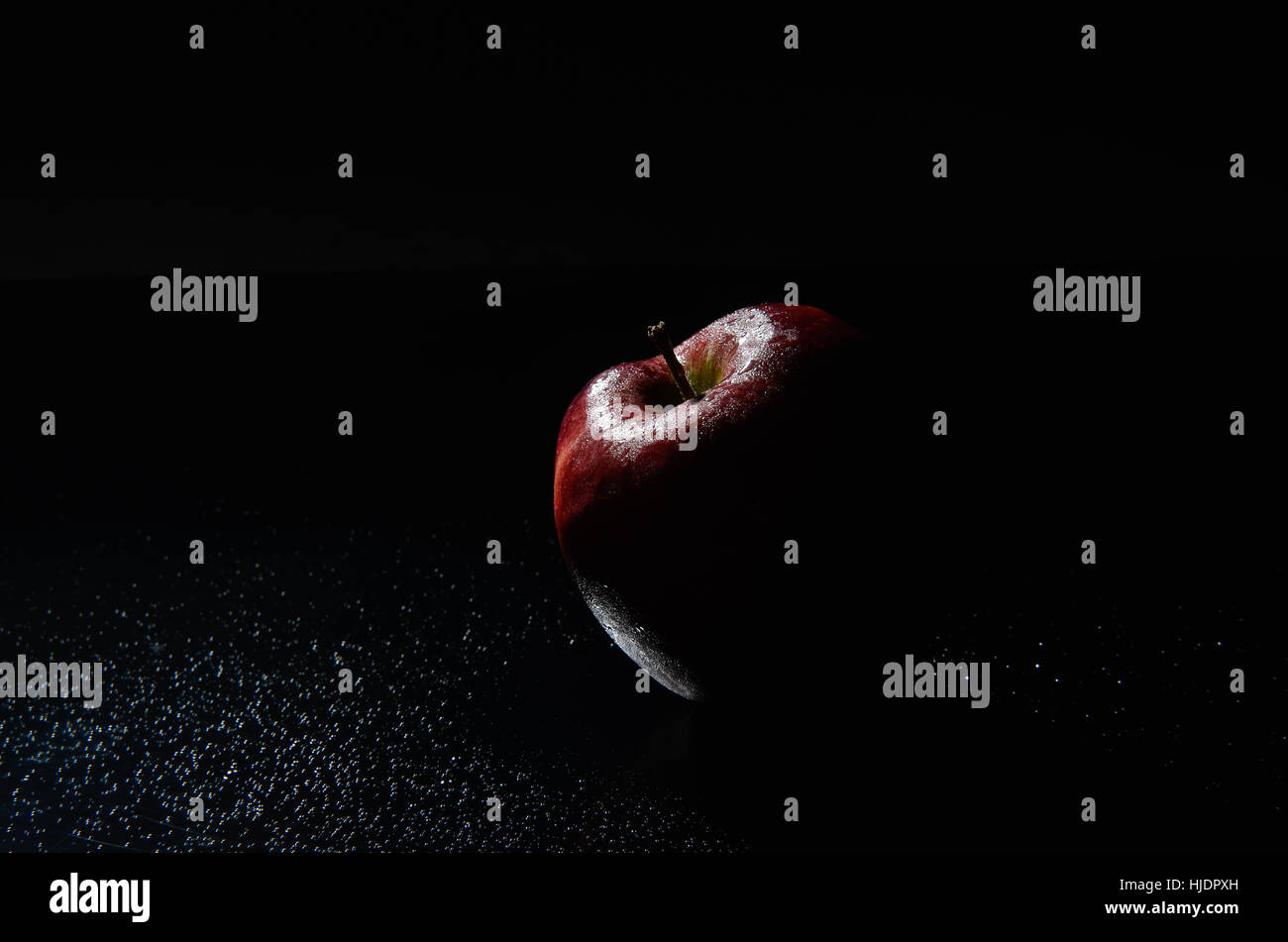 Red Apple On Black Background Stock Photo - Alamy
