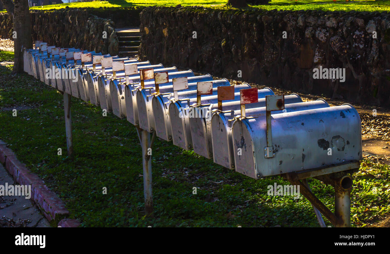 Row of Metal Mailboxes With Flags Up Stock Photo - Alamy