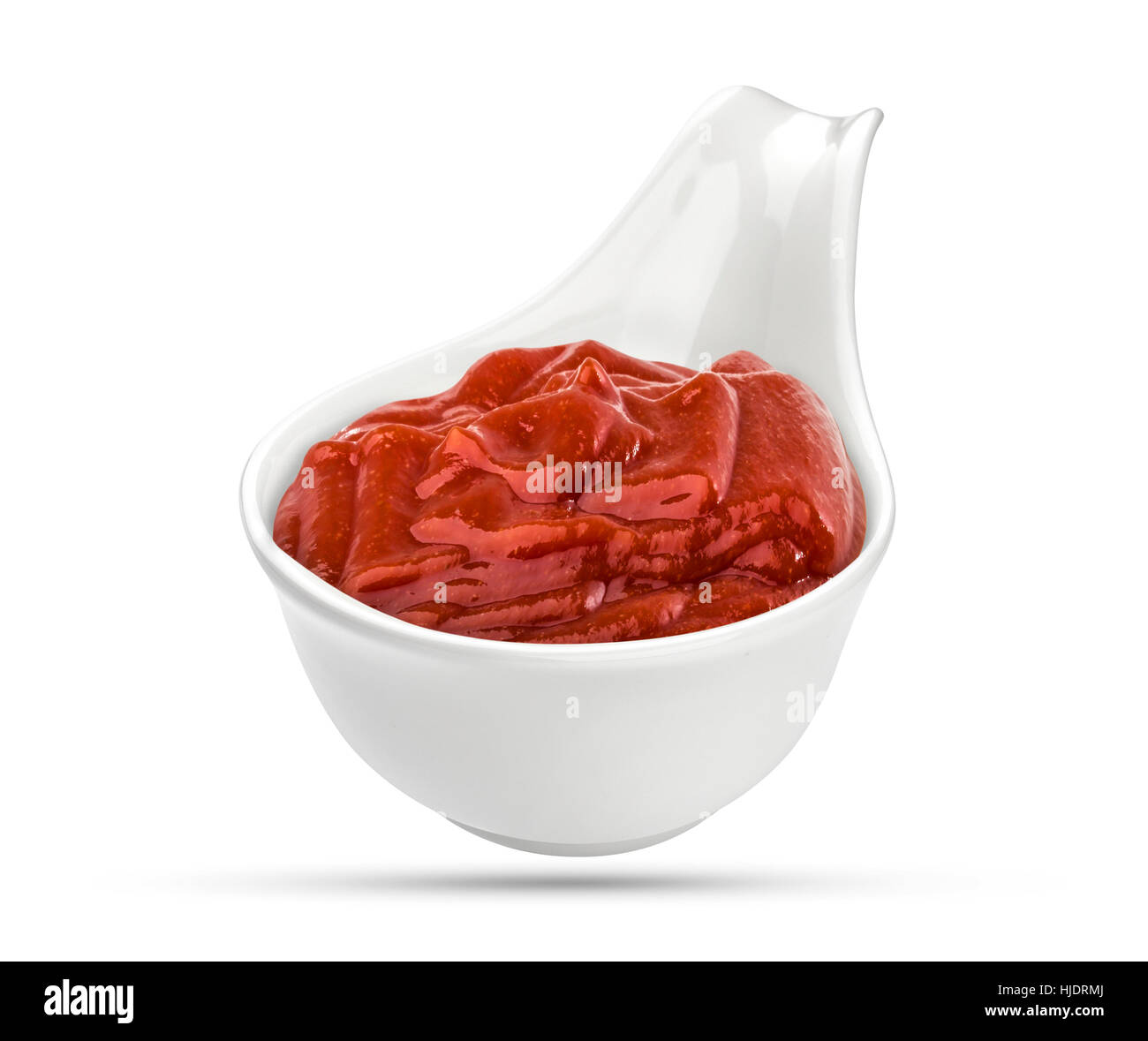 Ketchup in bowl isolated on white Stock Photo - Alamy