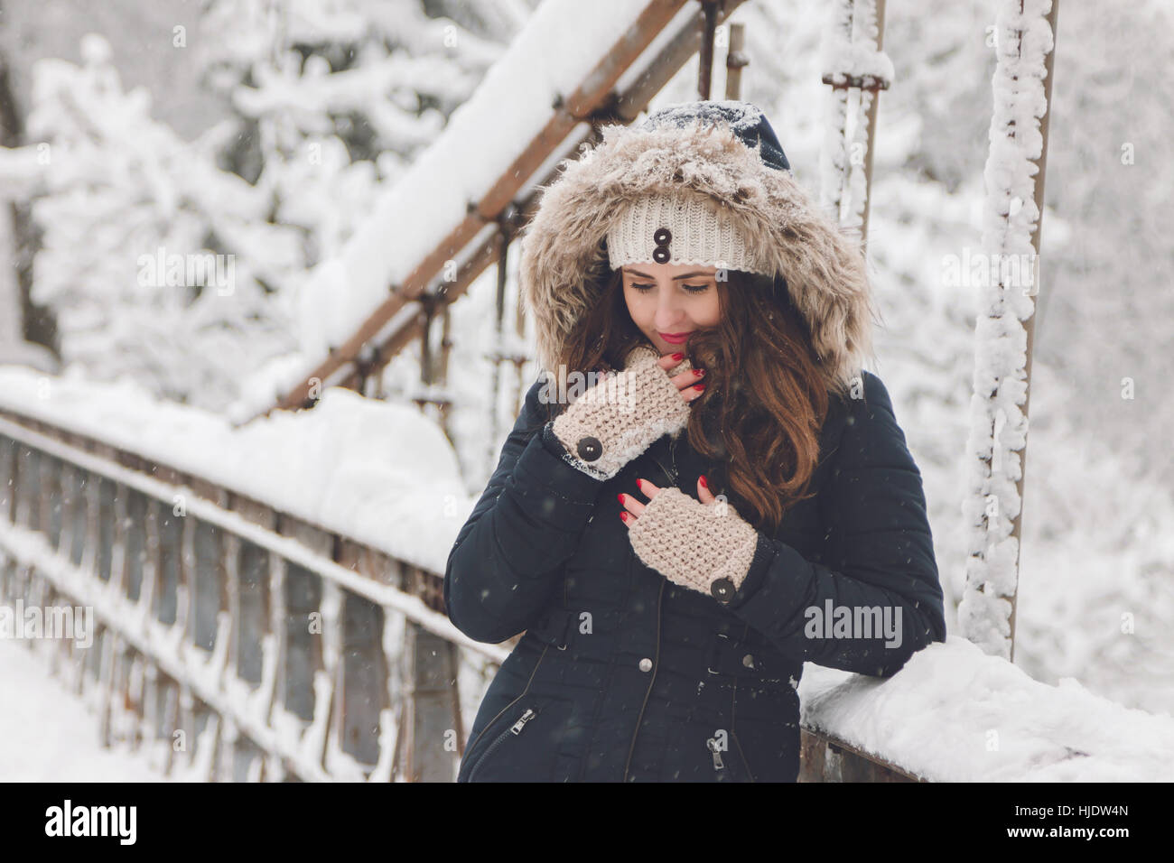 Winter portrait of a beautiful woman in the snowfall Stock Photo - Alamy