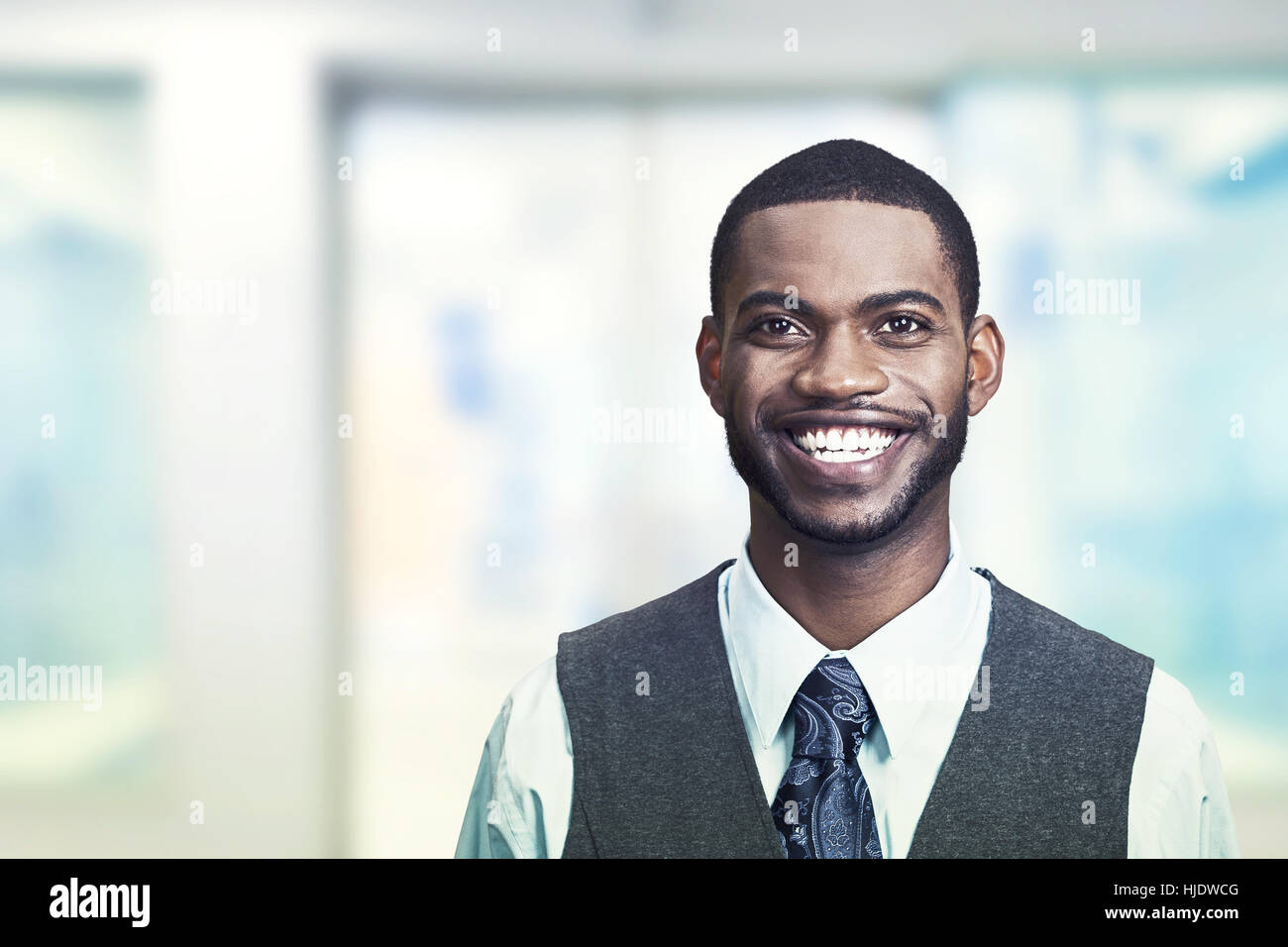Portrait of a young smiling businessman. Positive face expression Stock ...