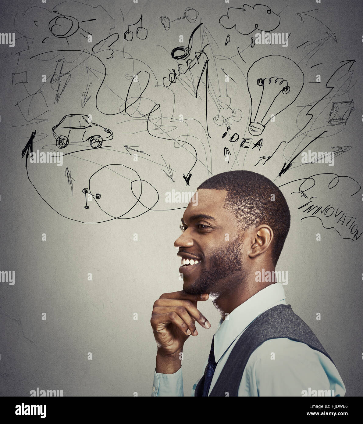 Closeup portrait happy young man has many ideas isolated on gray wall ...