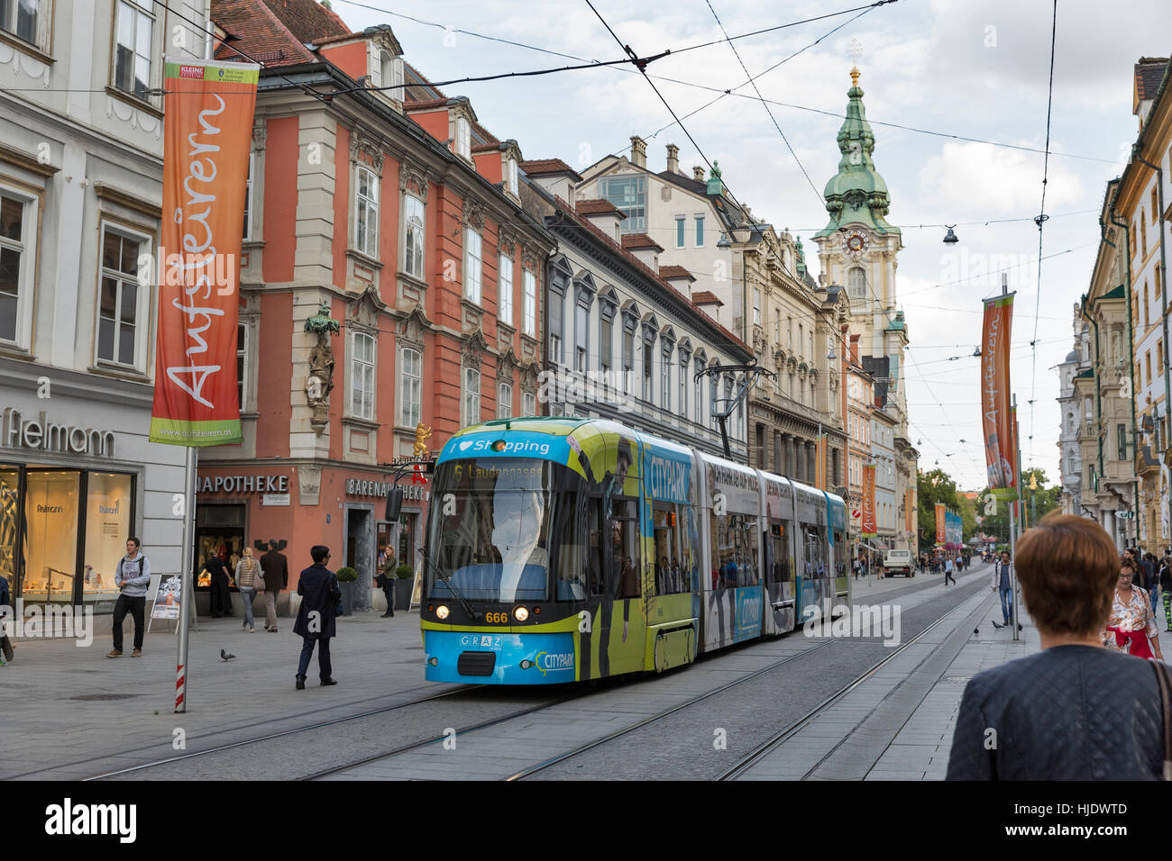 GRAZ, AUSTRIA - SEPTEMBER 11, 2015: City tram and unrecognized people ...