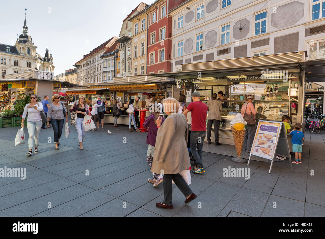 GRAZ, AUSTRIA - SEPTEMBER 12, 2015: Unrecognized people visit street ...