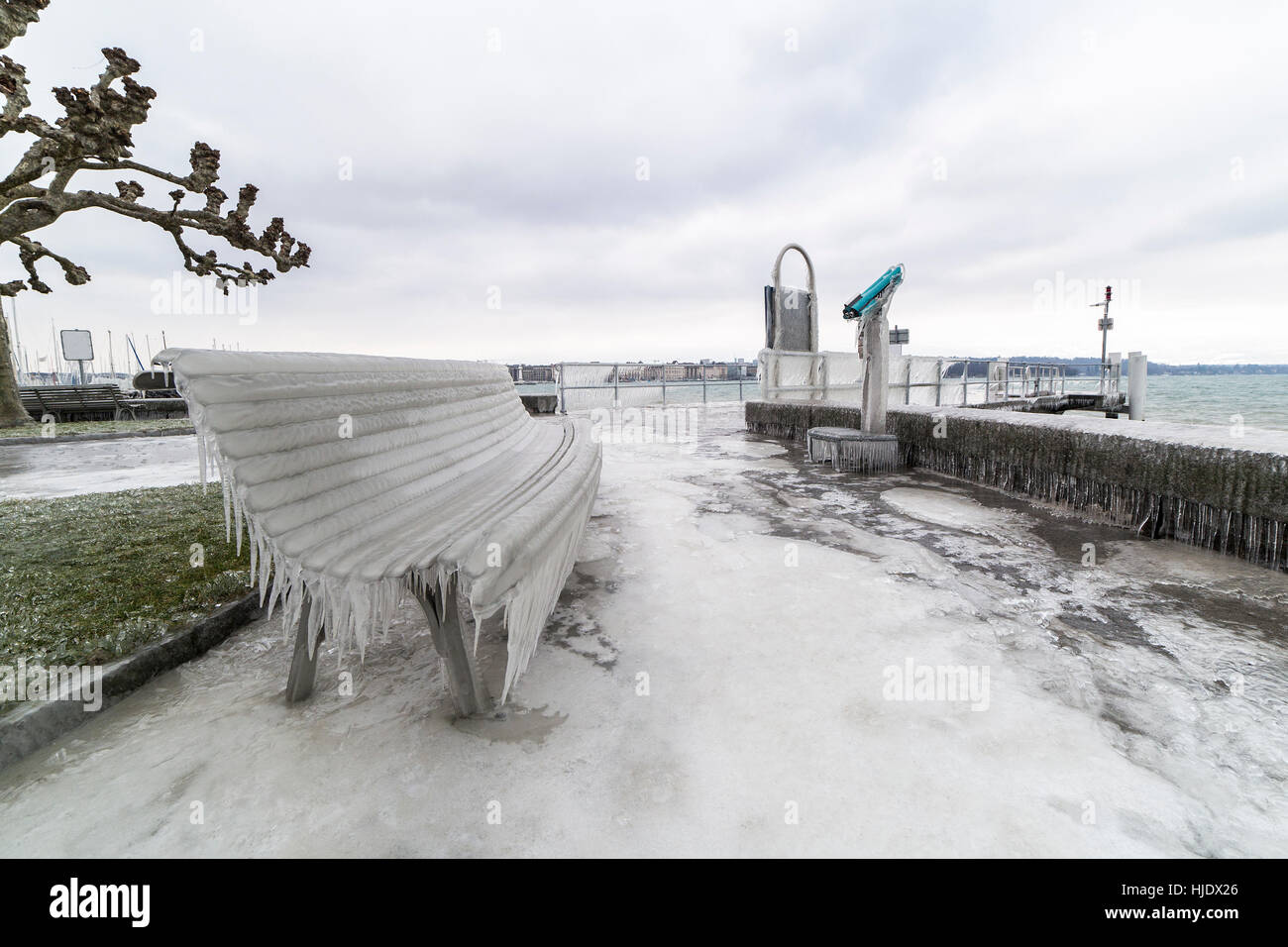 Lakeside promenade covered with ice after a winter storm on Lake Geneva ...